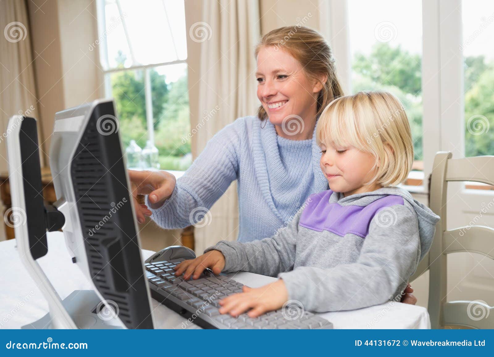 Cute Daughter and Mother Using Computer Stock Photo - Image of life ...