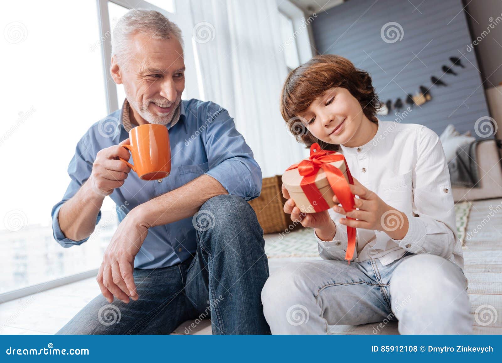 Cute Delighted Child Looking at the Gift Box Stock Photo - Image of ...