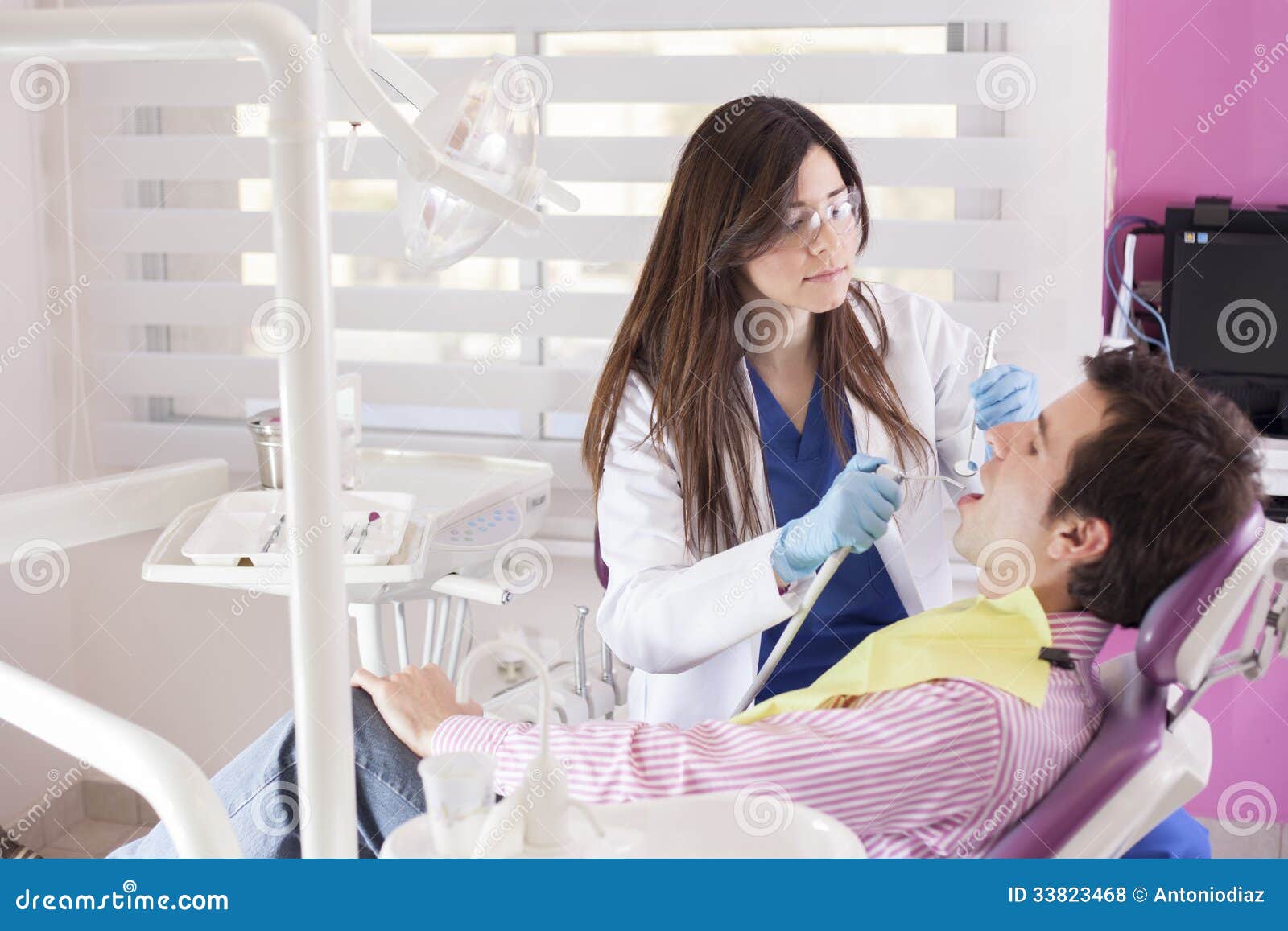 Cute Dentist Focused at Work Stock Photo - Image of health, orthodontic ...