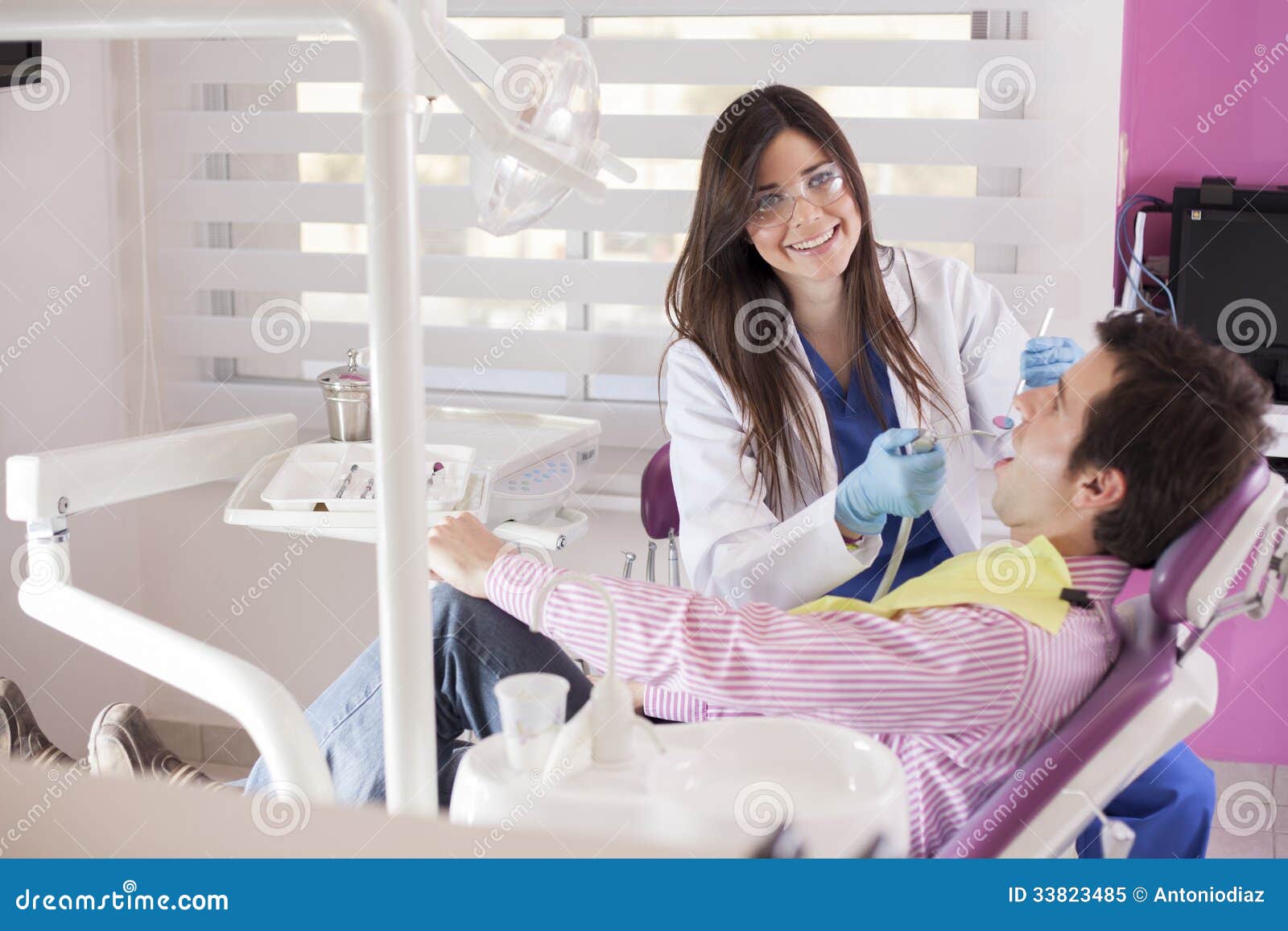 Cute dentist at work stock image. Image of coat, instruments - 33823485