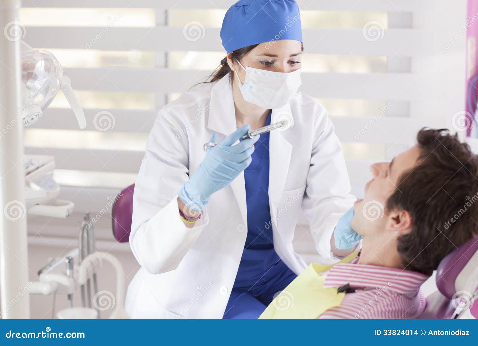 Cute dentist at work stock photo. Image of oral, dentist - 33824014