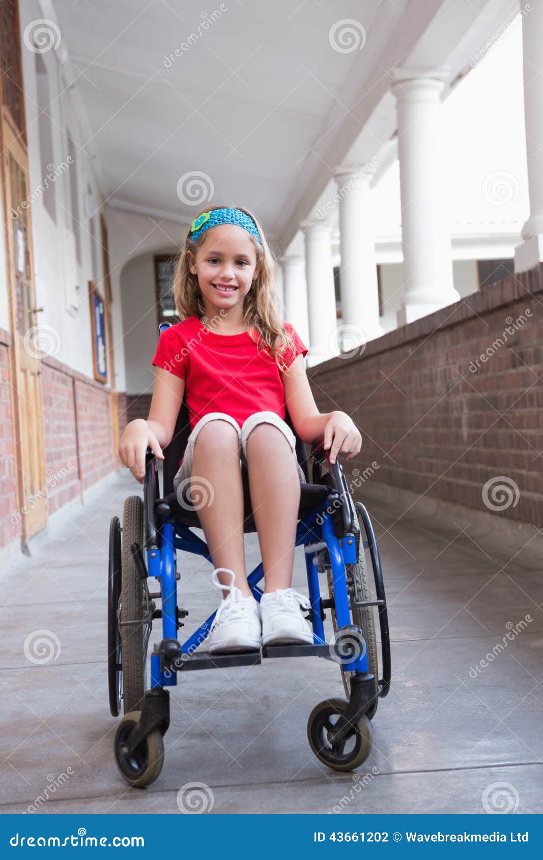 Cute Disabled Pupil Smiling at Camera in Hall Stock Photo - Image of ...