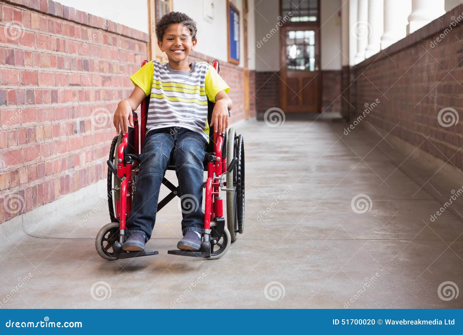 Cute Disabled Pupil Smiling at Camera in Hall Stock Photo - Image of ...
