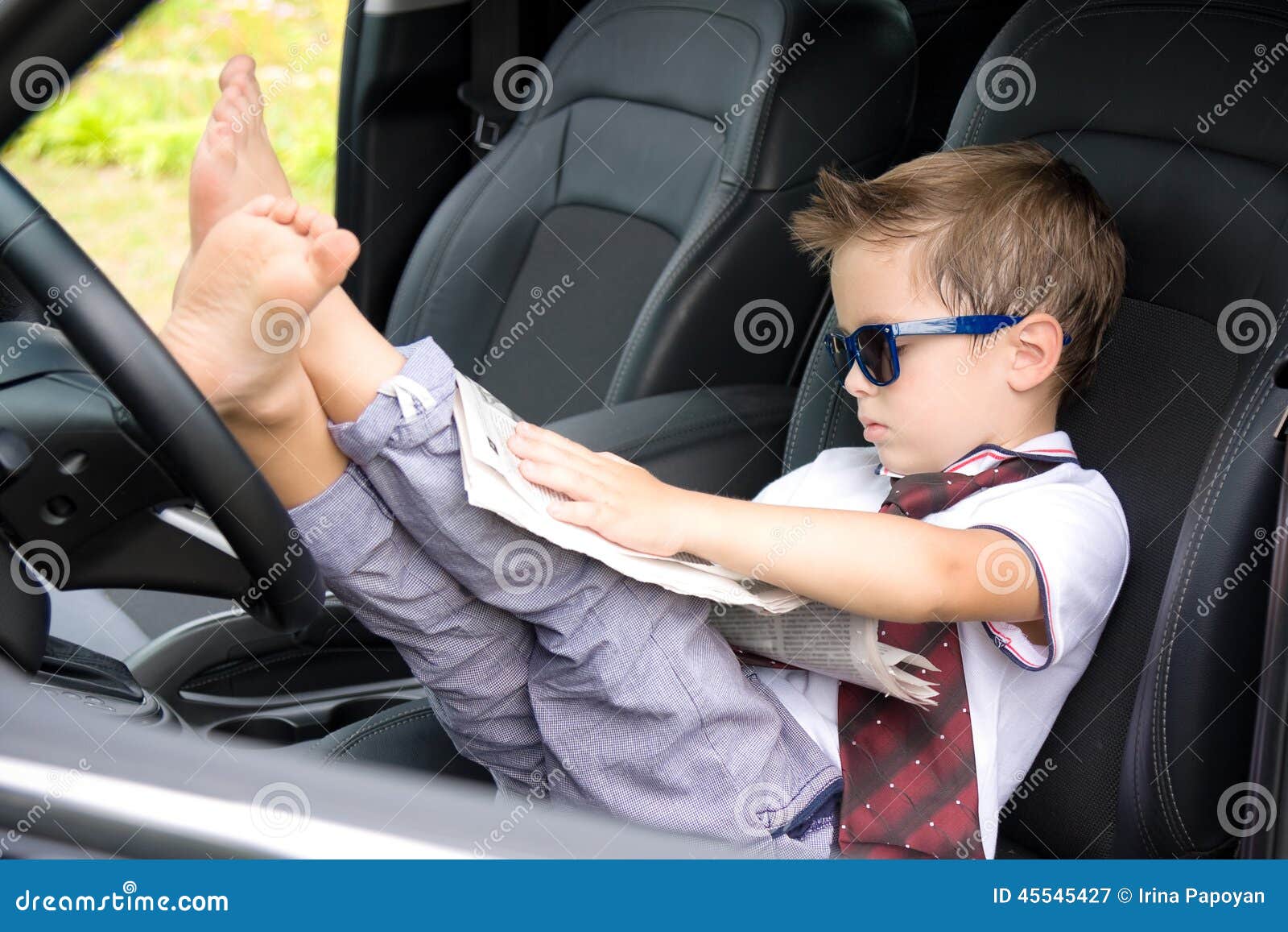 Cute Driver Reads Newspaper in Car Stock Image - Image of childhood ...