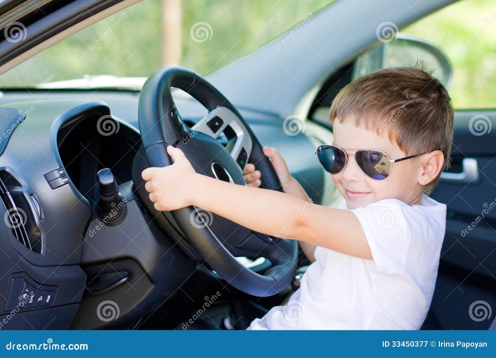 Cute driver sits in car stock image. Image of preschooler - 33450377