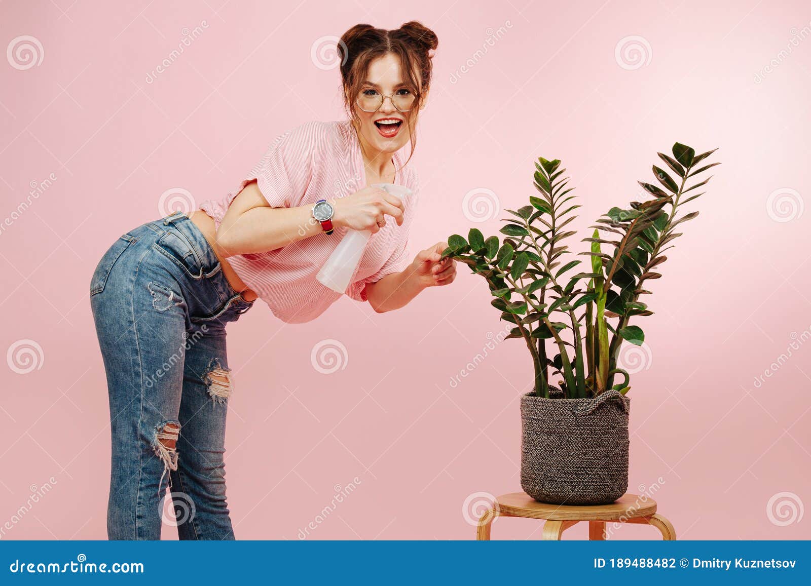 Provocative Eccentric Overly Happy Girl Watering Plant with Sprinkler ... Provocative Eccentric Overly Happy Girl Watering Plant with Sprinkler ...