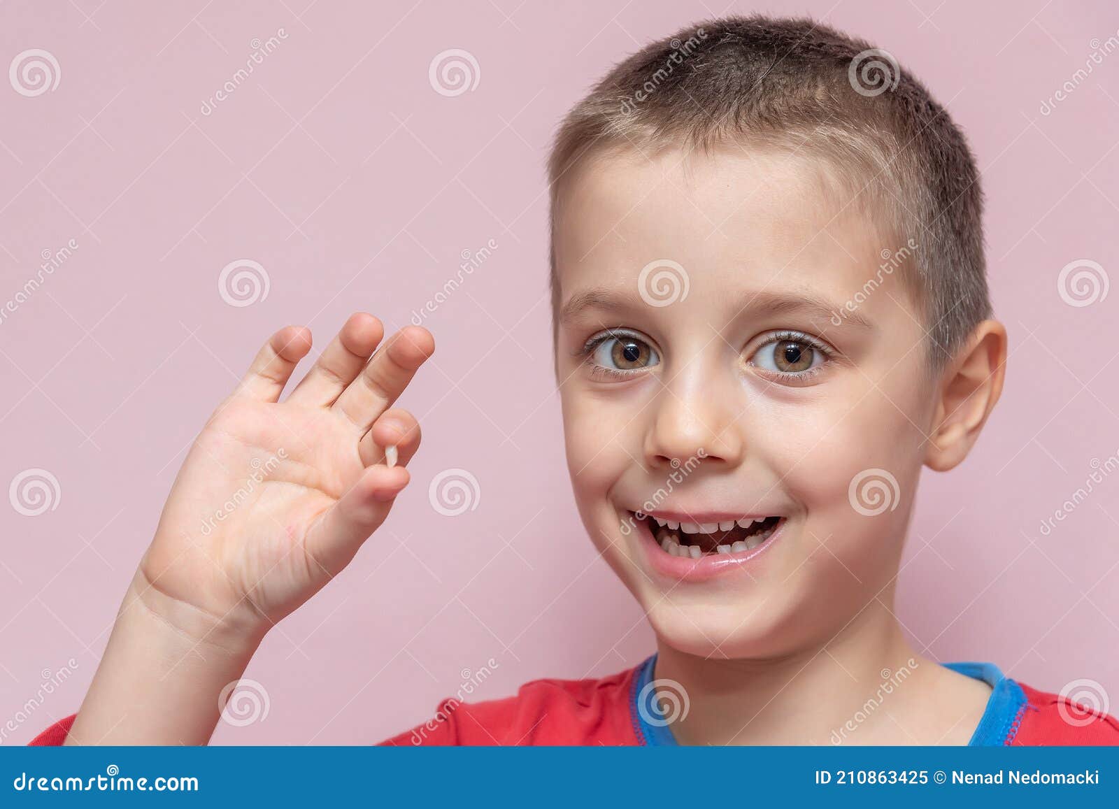 Cute Elementary Age Boy is Pulled His Baby Tooth with Hand Himself ...