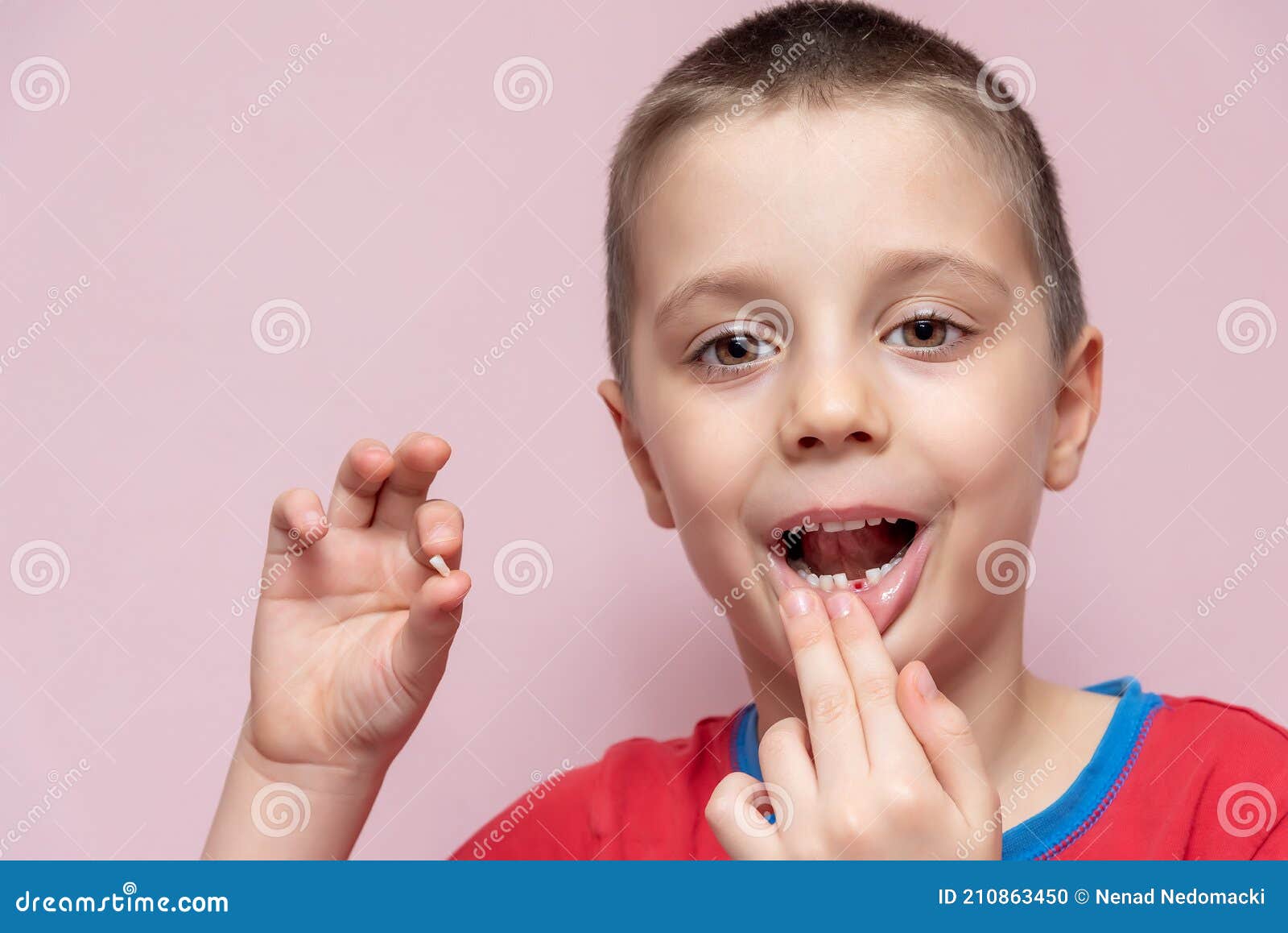 Cute Elementary Age Boy is Pulled His Baby Tooth with Hand Himself ...