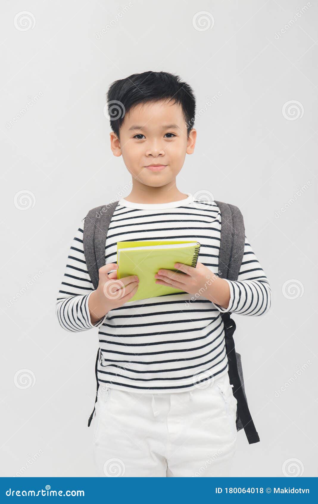 Cute Elementary School Boy Holding Books on White Background Stock ...