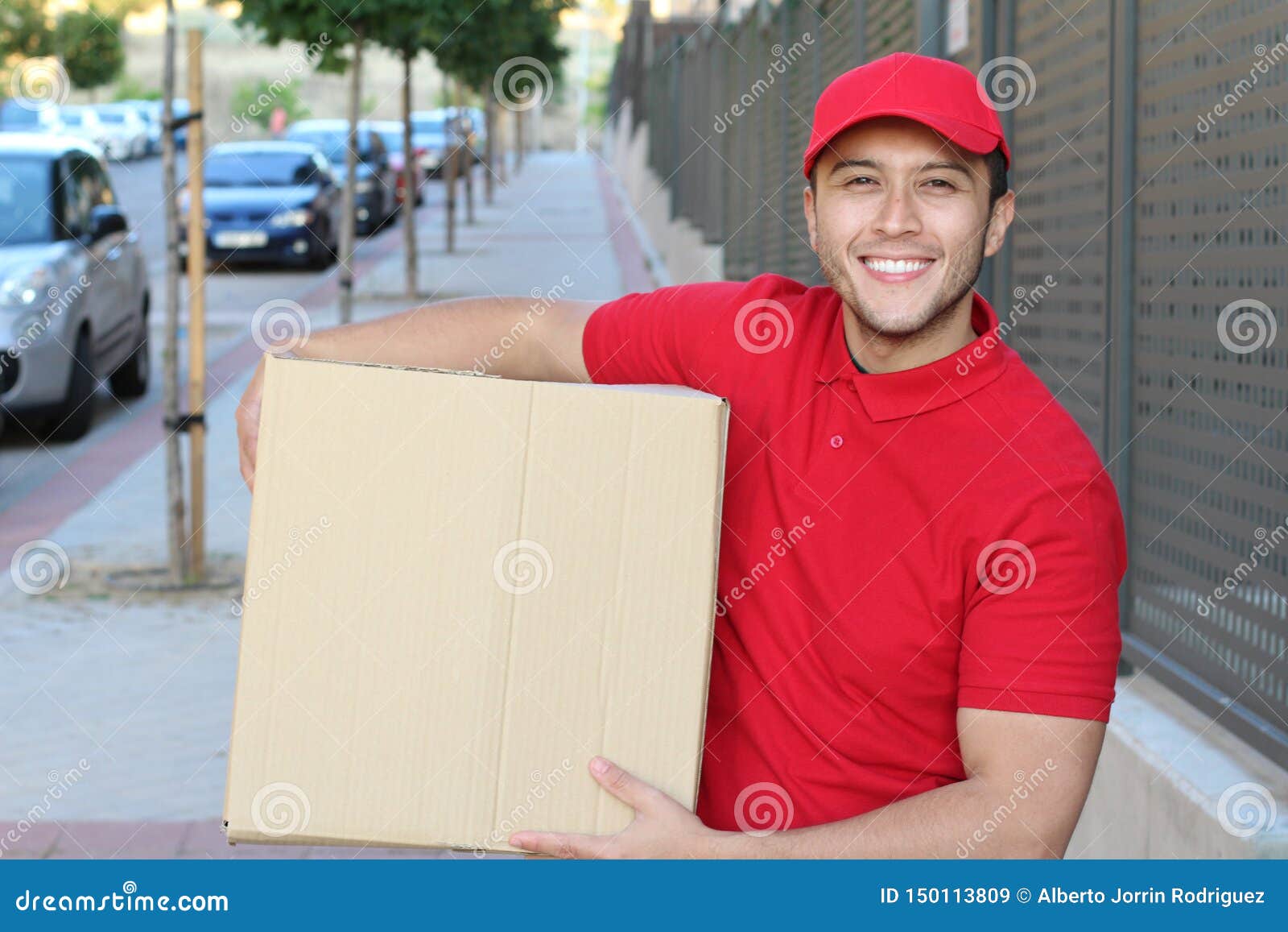 Cute Ethnic Delivery Man Smiling Outdoors Stock Image - Image of ...