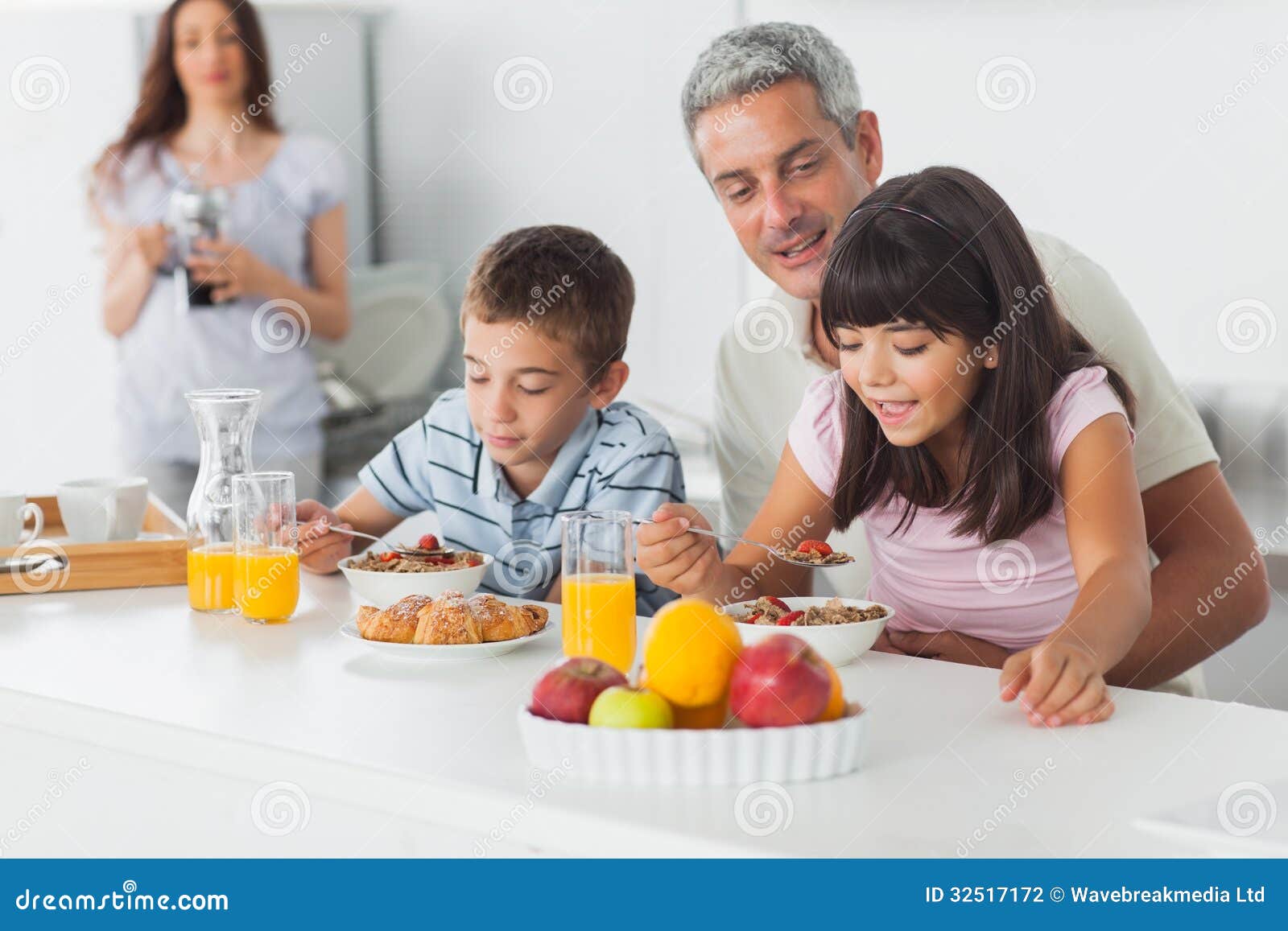 Cute Family Eating Breakfast in Kitchen Together Stock Photo - Image of ...