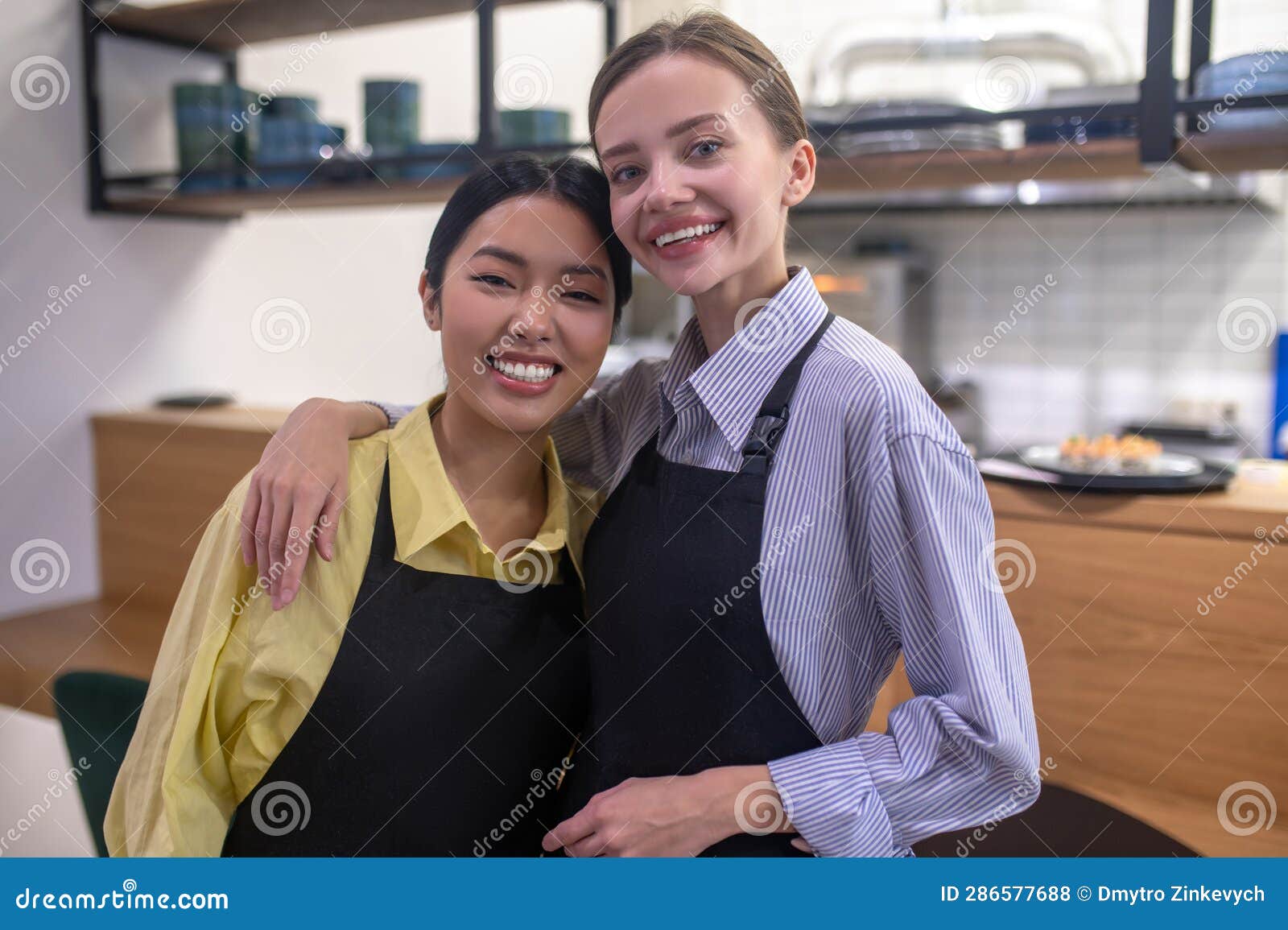 Cute Female Colleagues at the Working Place at the Cafe Stock Photo ...