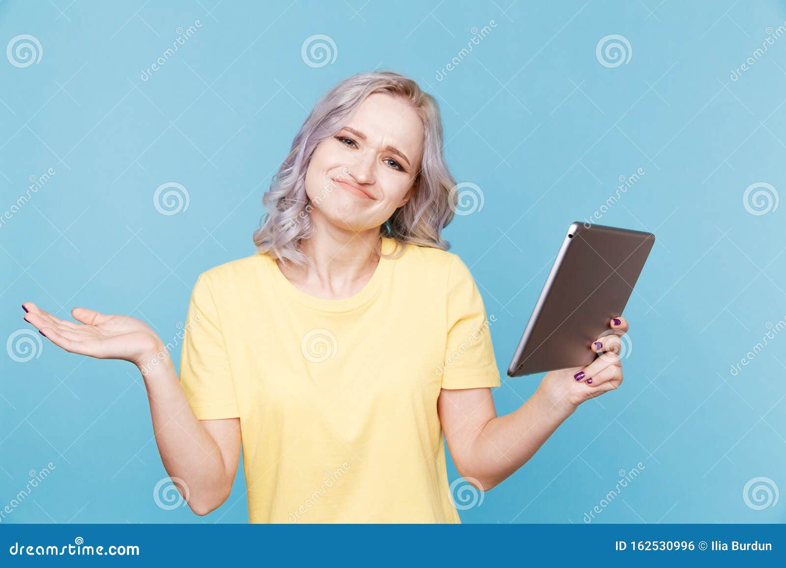Cute Female Holding Tablet with Funny Face Isolated. Stock Photo ...