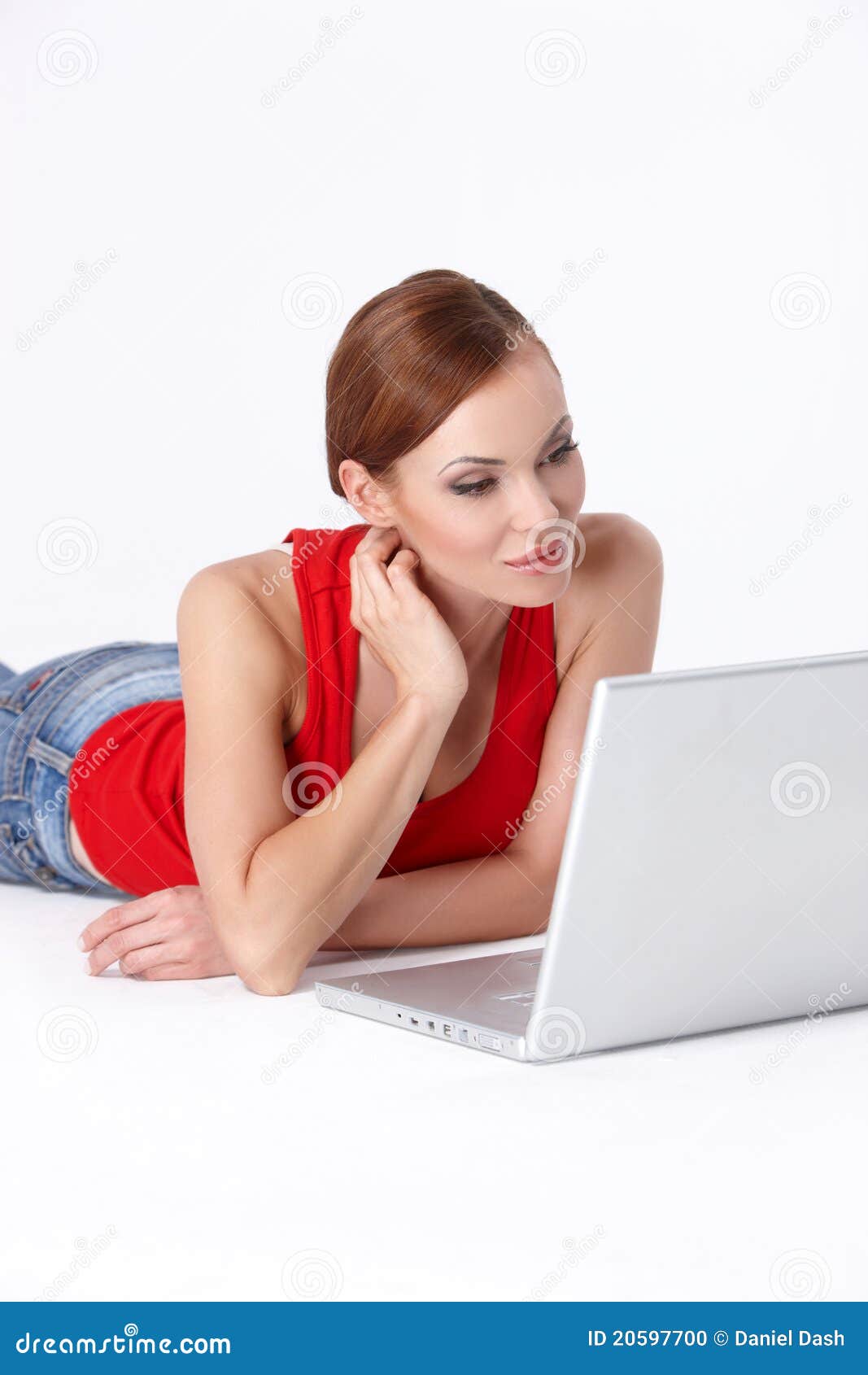 Cute Female Lying Down and Using a Laptop Stock Photo - Image of ...