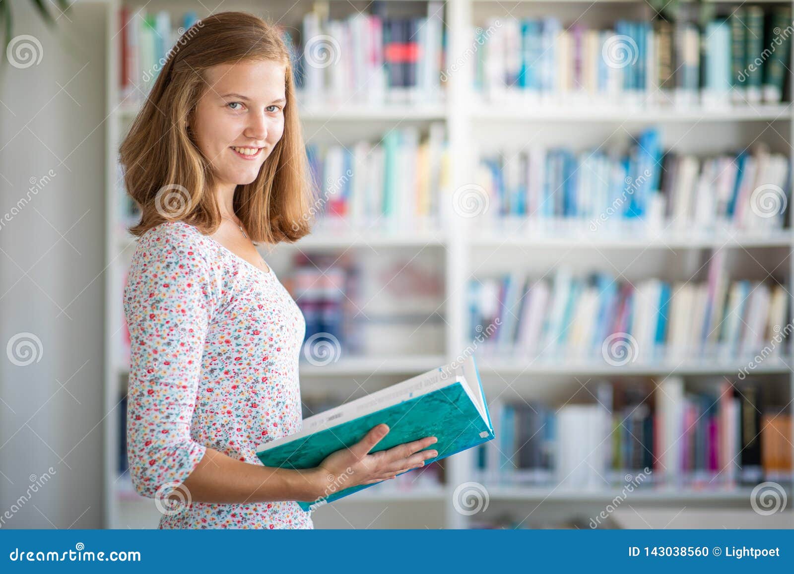 Cute Female Student with Books in Library Stock Photo - Image of ...