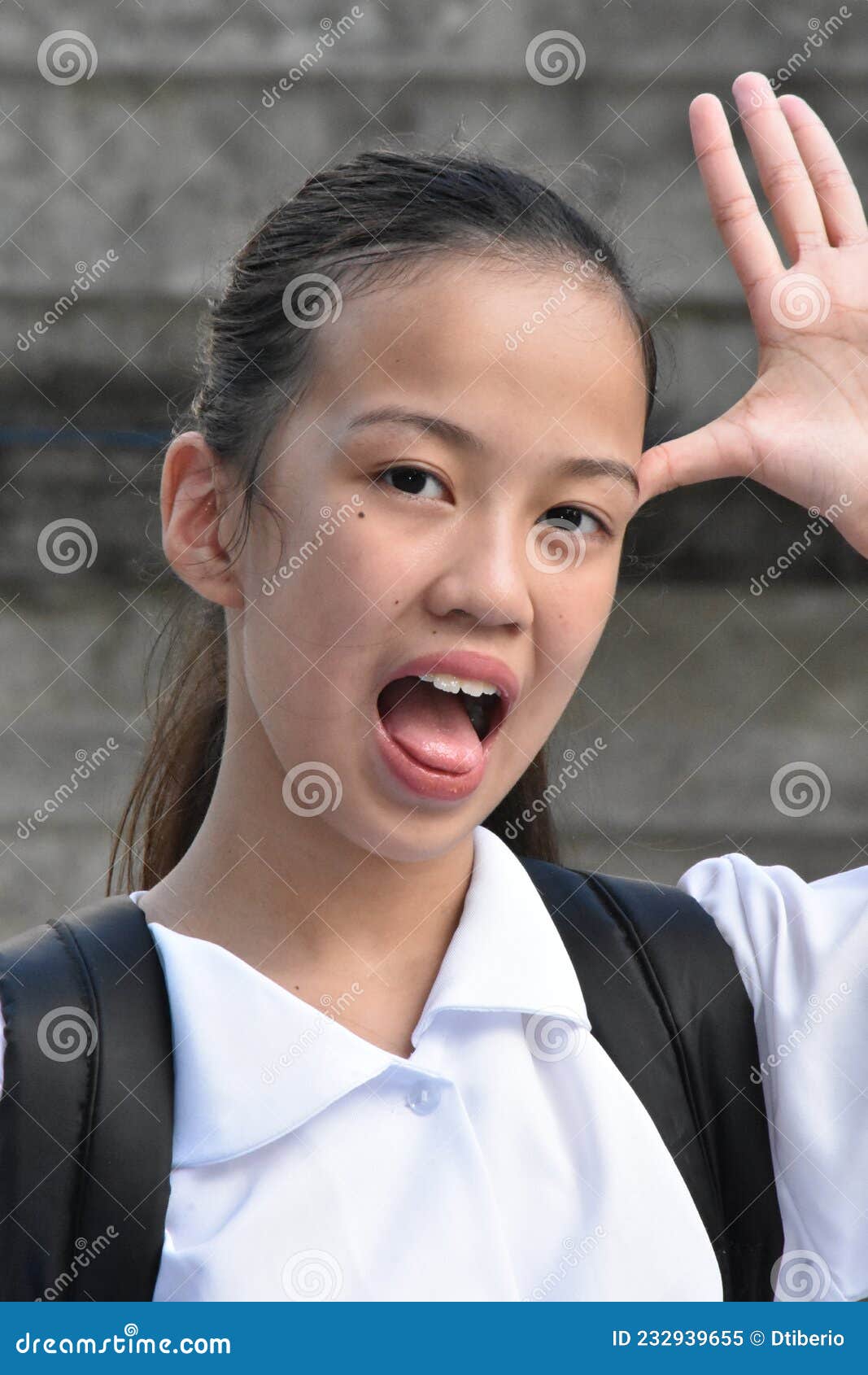 Cute Female Student Making Funny Faces with School Books Stock Image ...