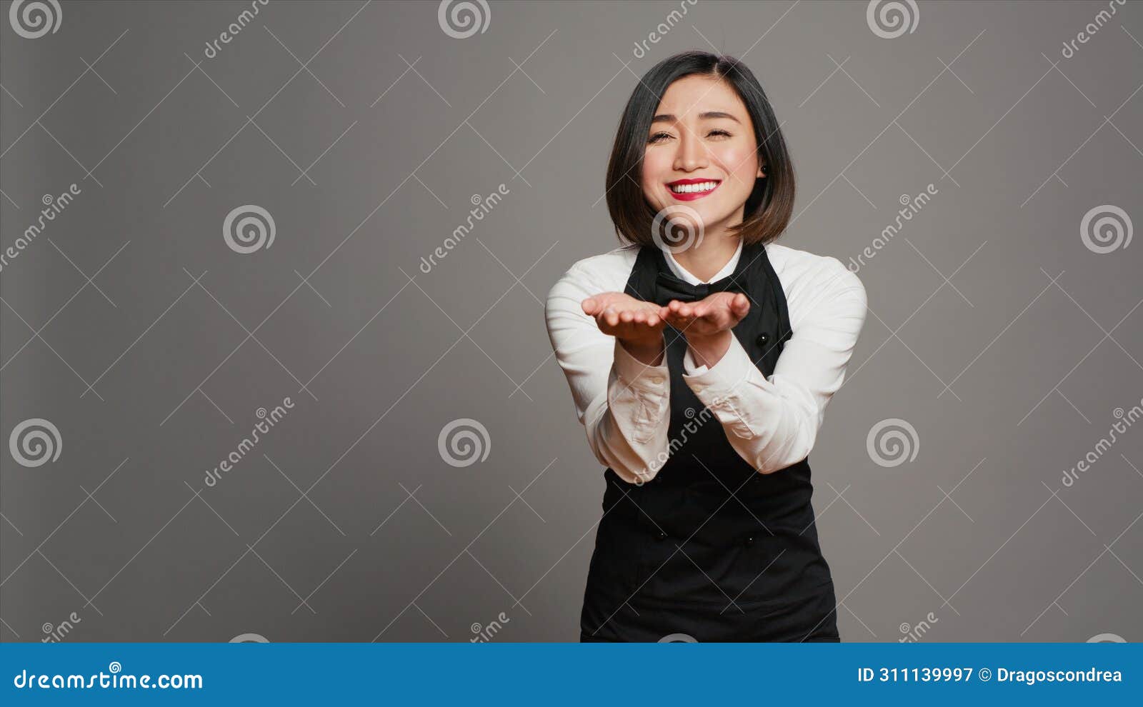 Cute Flirty Waitress Blowing Air Kisses In Front Of Camera Stock Image
