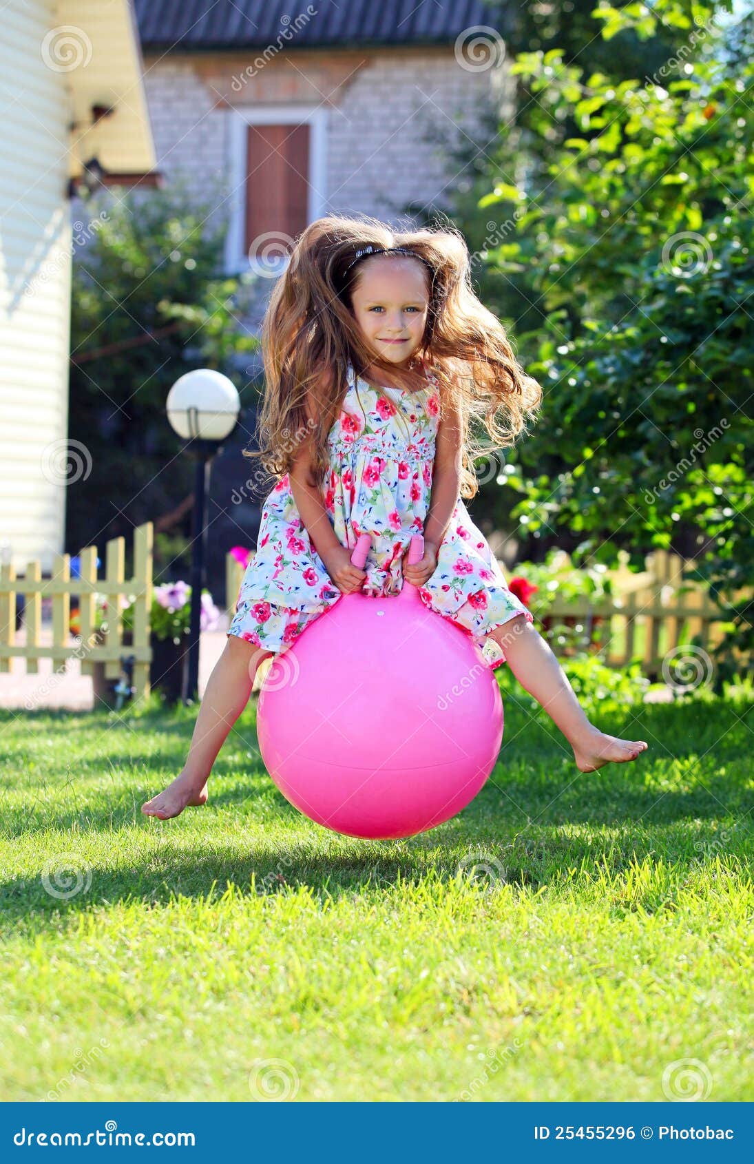 Cute Four-year Girl Bouncing on a Big Ball Stock Photo - Image of ...