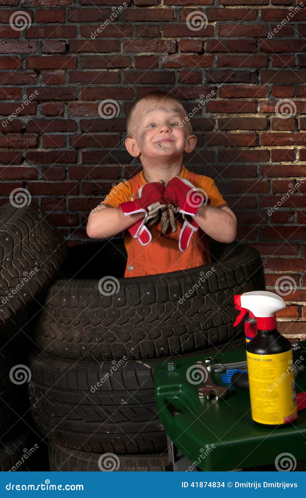 Cute and Funny Little Mechanic with a Tire Stock Photo - Image of ...