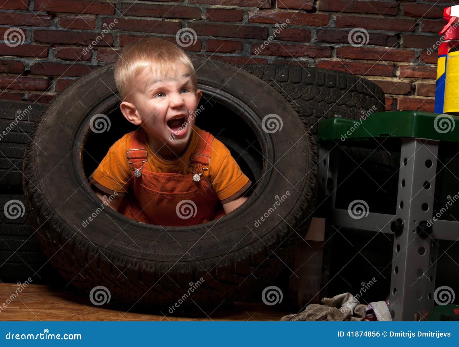 Cute and Funny Little Mechanic with a Tire Stock Photo - Image of ...