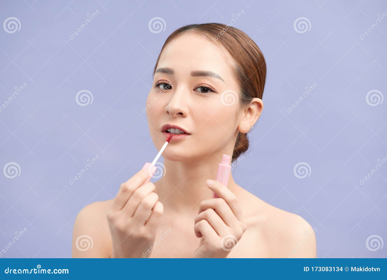Cute Girl Applying Lip Gloss Stock Photo - Image of attractive, gloss ...