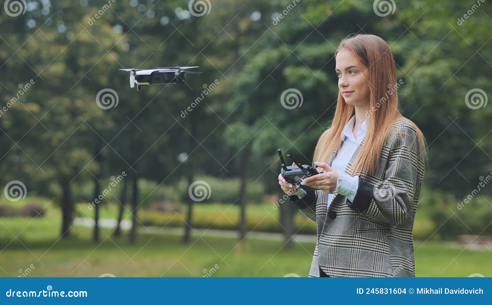 A Cute Girl Controls a Drone in the Park. Stock Footage - Video of ...