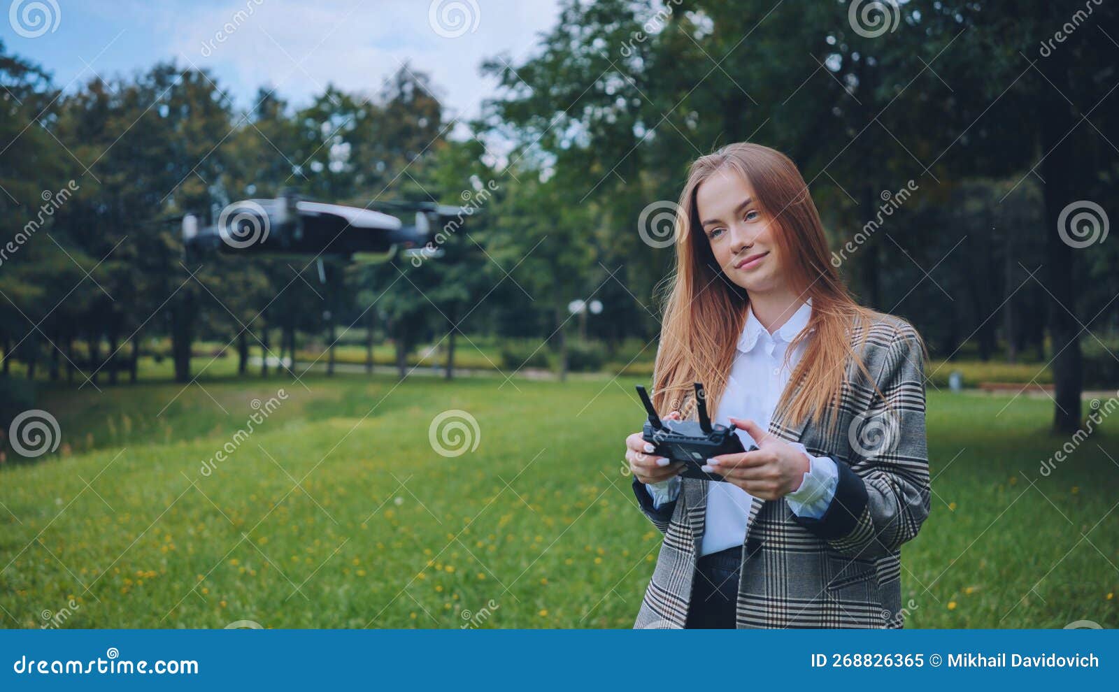 A Cute Girl Controls a Drone in the Park. Stock Image - Image of ...