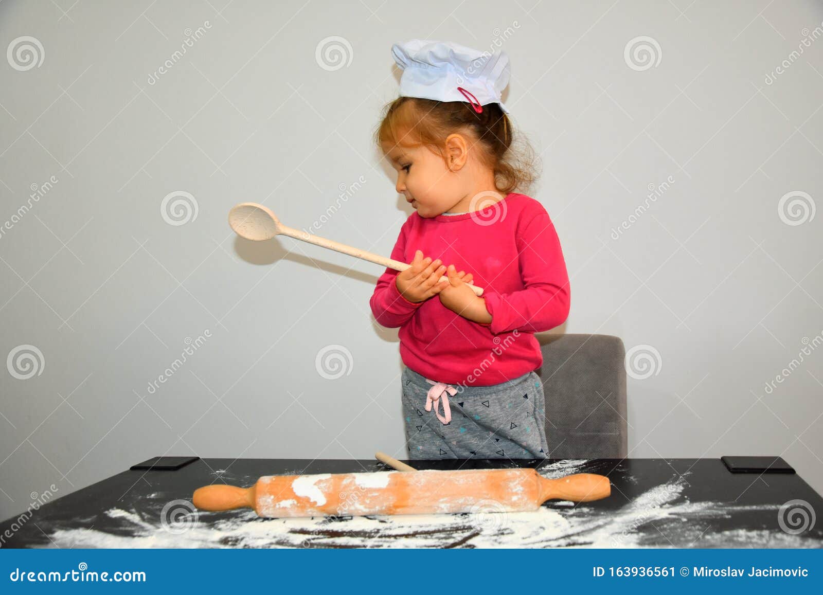 Cute Girl Cooking in Kitchen at Home Stock Image - Image of apron ...