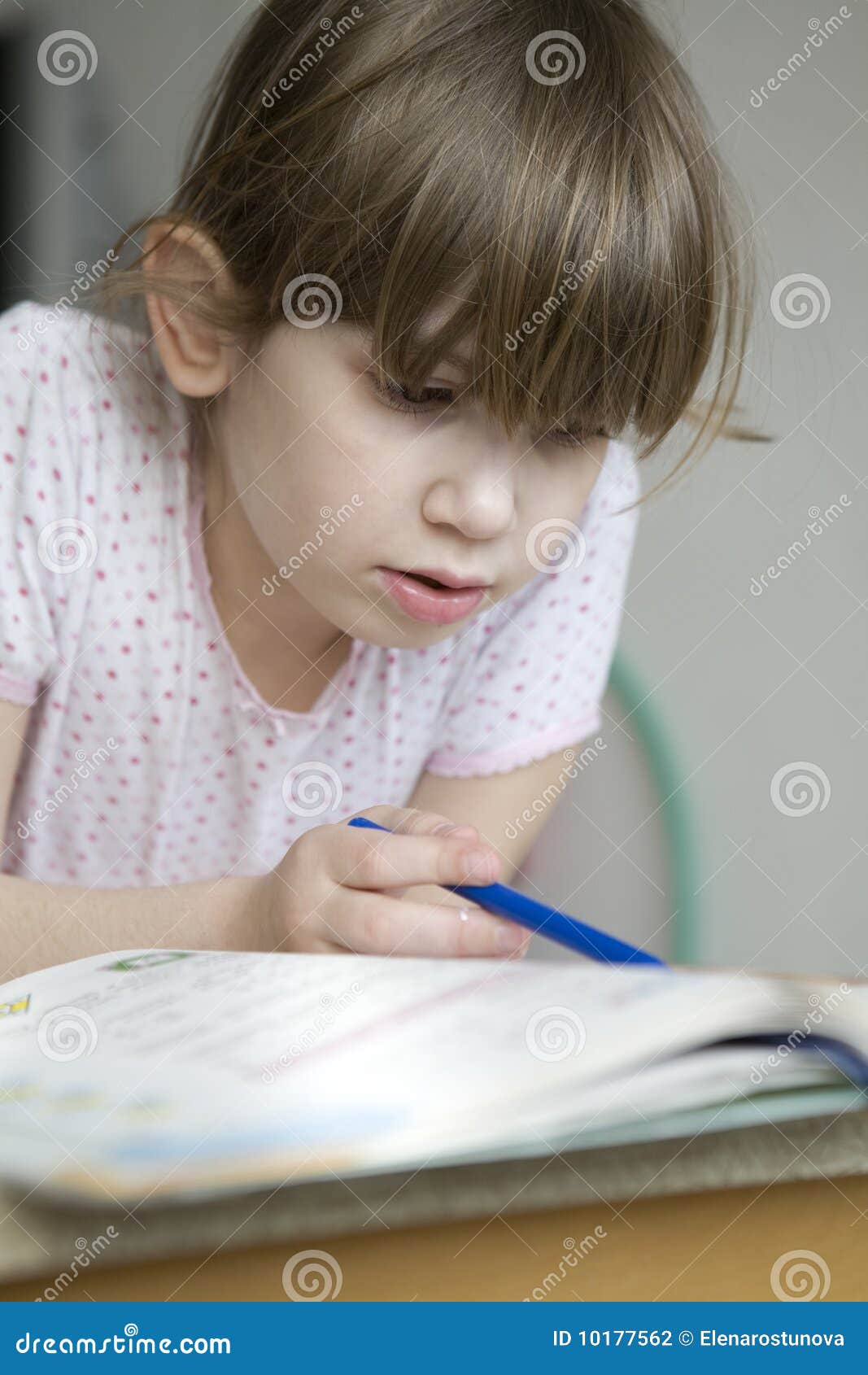 Cute girl doing homework stock photo. Image of serious - 10177562