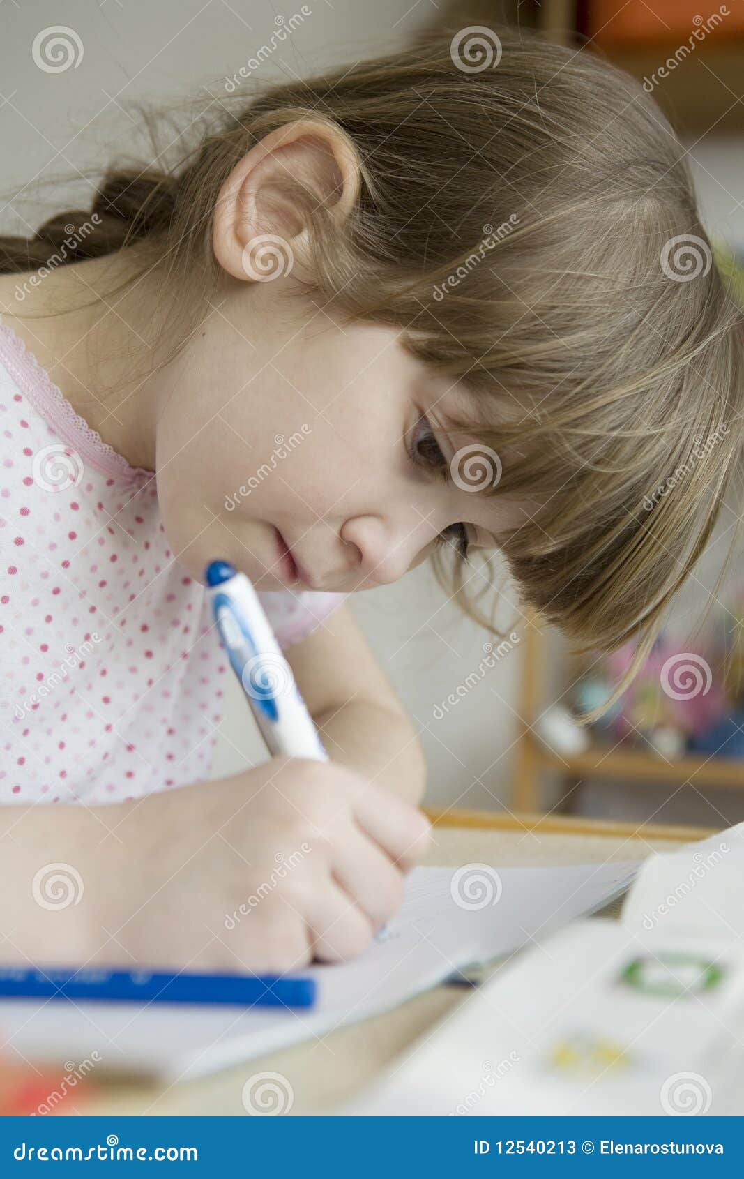 Cute girl doing homework stock image. Image of book, unhappy - 12540213
