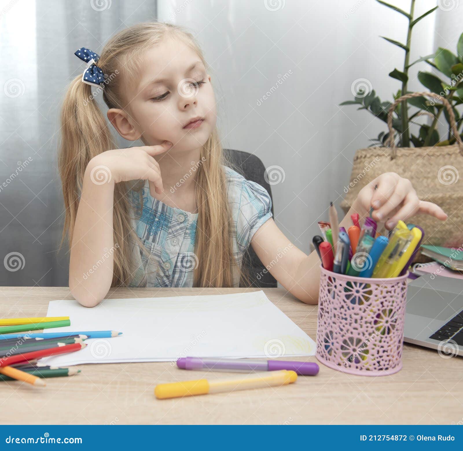 Cute girl doing homework stock photo. Image of childhood - 212754872