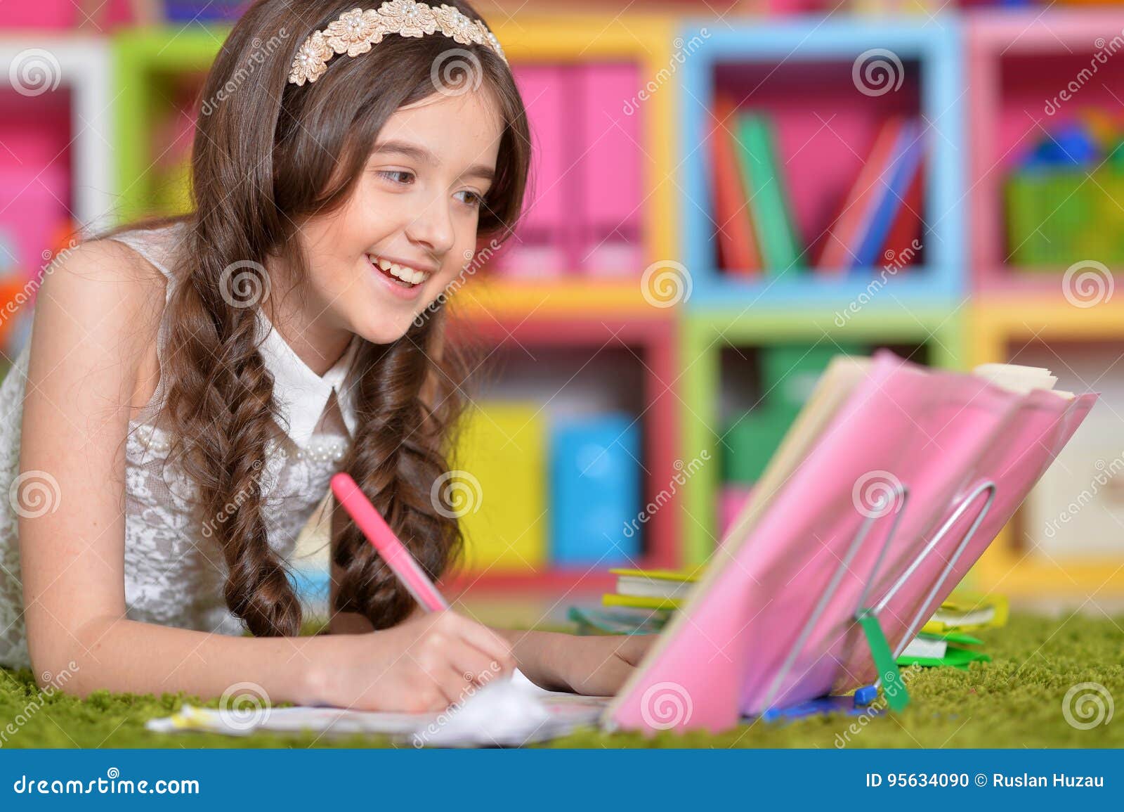 Cute girl doing homework stock photo. Image of elementary - 95634090