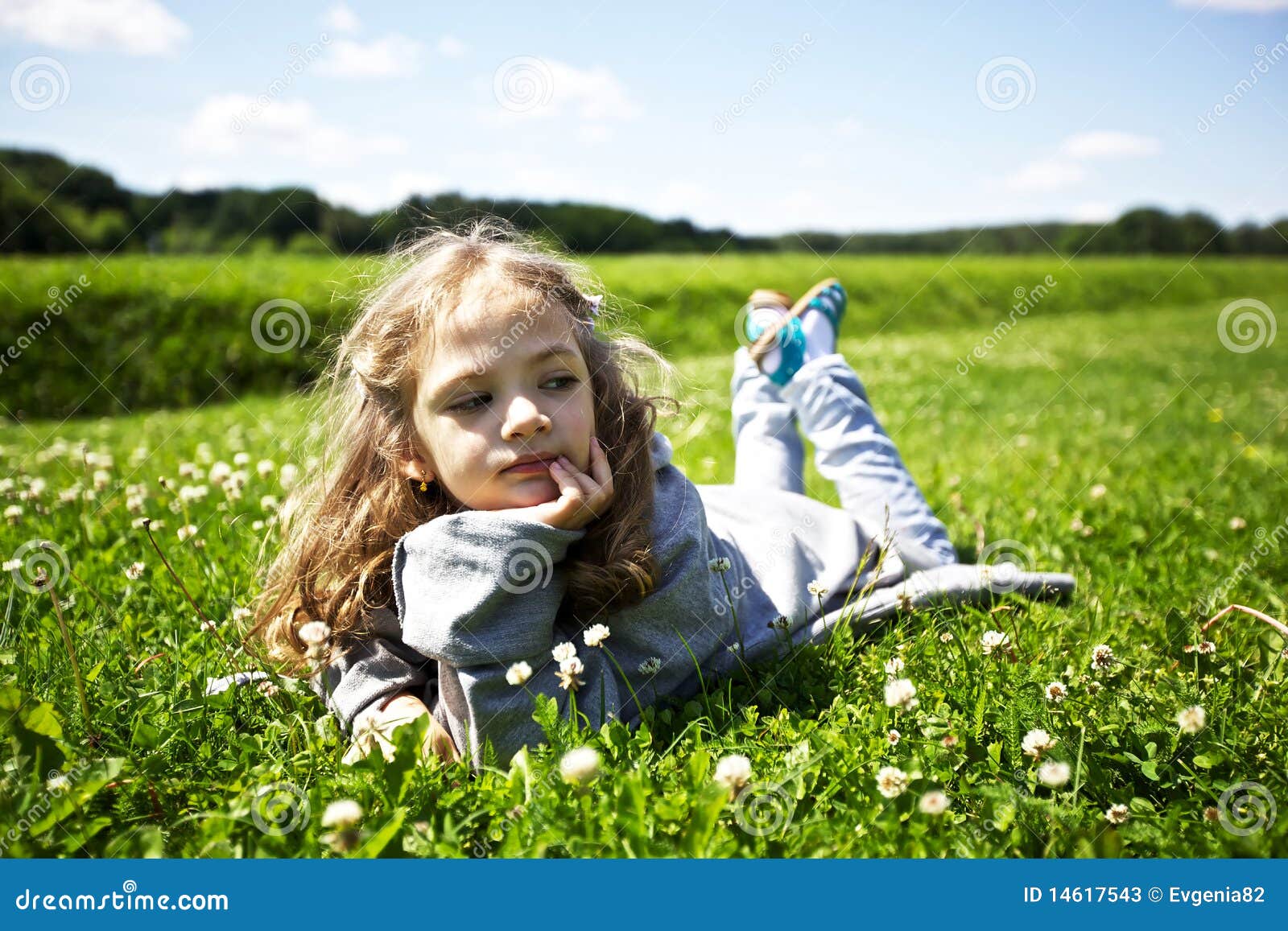 Cute girl at a green field stock image. Image of blue - 14617543