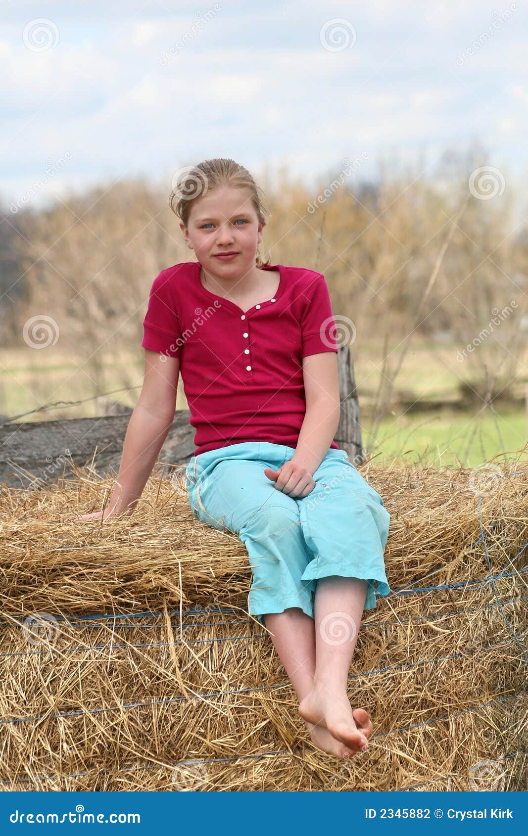 Cute girl on hay bale stock photo. Image of outside, girl - 2345882