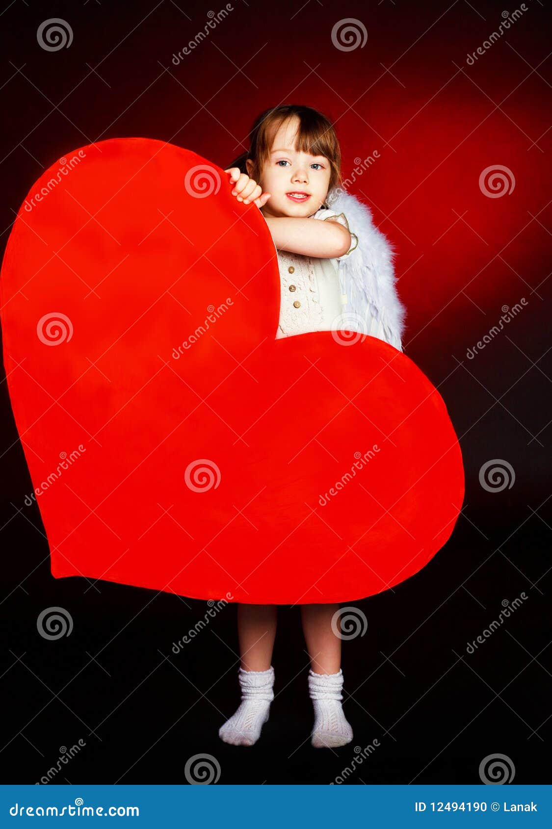 Cute girl with a heart stock photo. Image of romance - 12494190