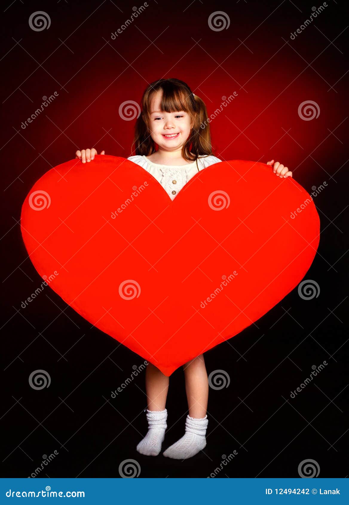 Cute girl with a heart stock photo. Image of give, childhood - 12494242
