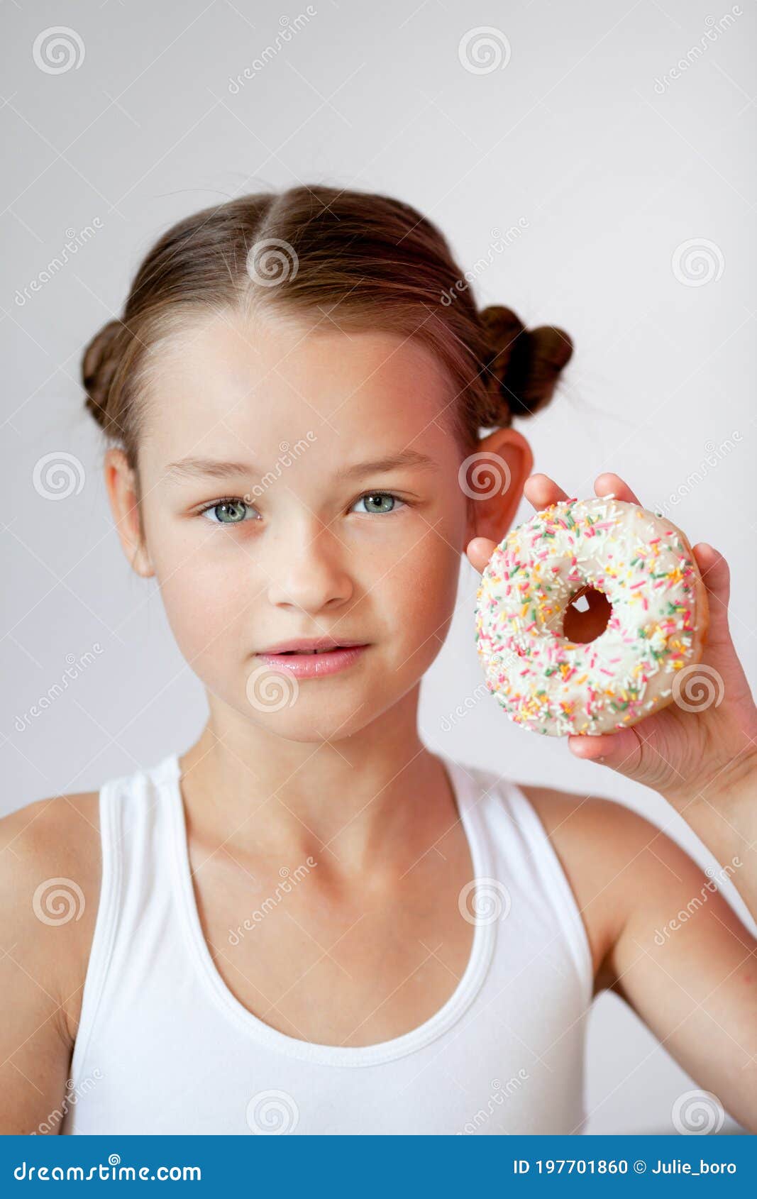 Cute Girl Holding an Appetizing Glazed Donut in Her Hands Stock Photo ...