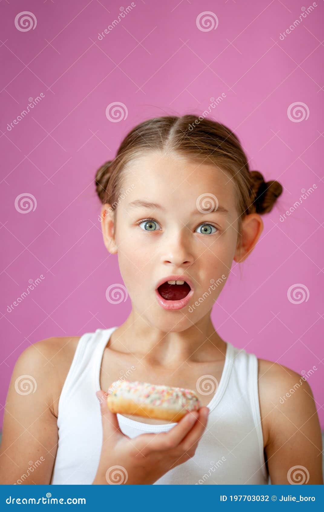 Cute Girl Holding an Appetizing Glazed Donut in Her Hands Stock Photo ...