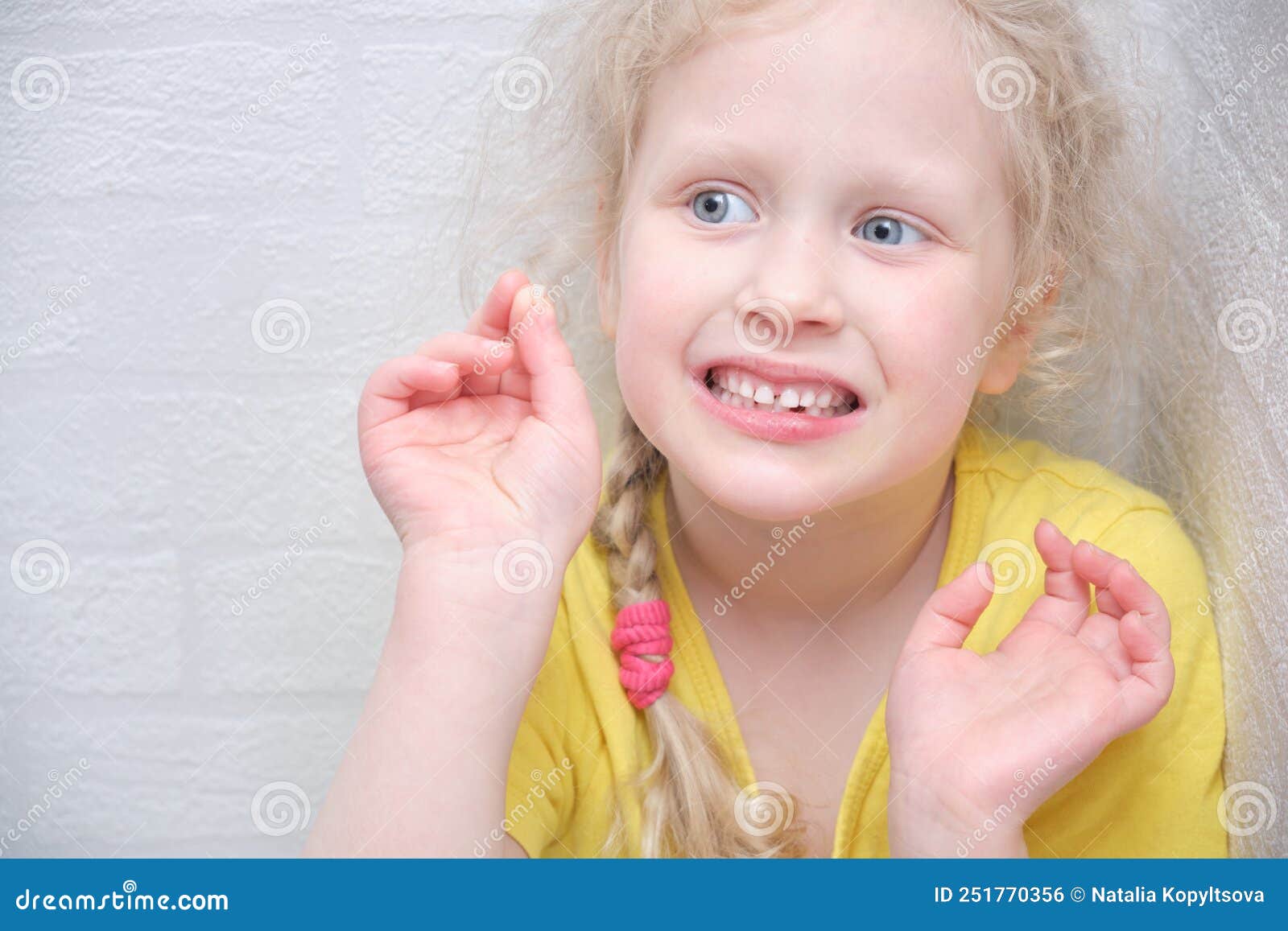 Cute Girl Holding Missing Tooth, White Wall Background Stock Photo ...