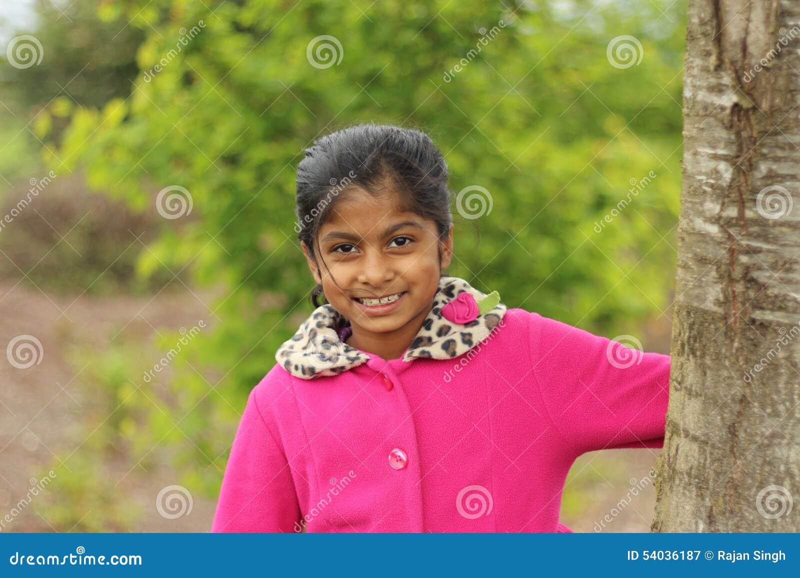 Cute Girl Holding Tree Trunk Stock Image - Image of joyful, holding ...