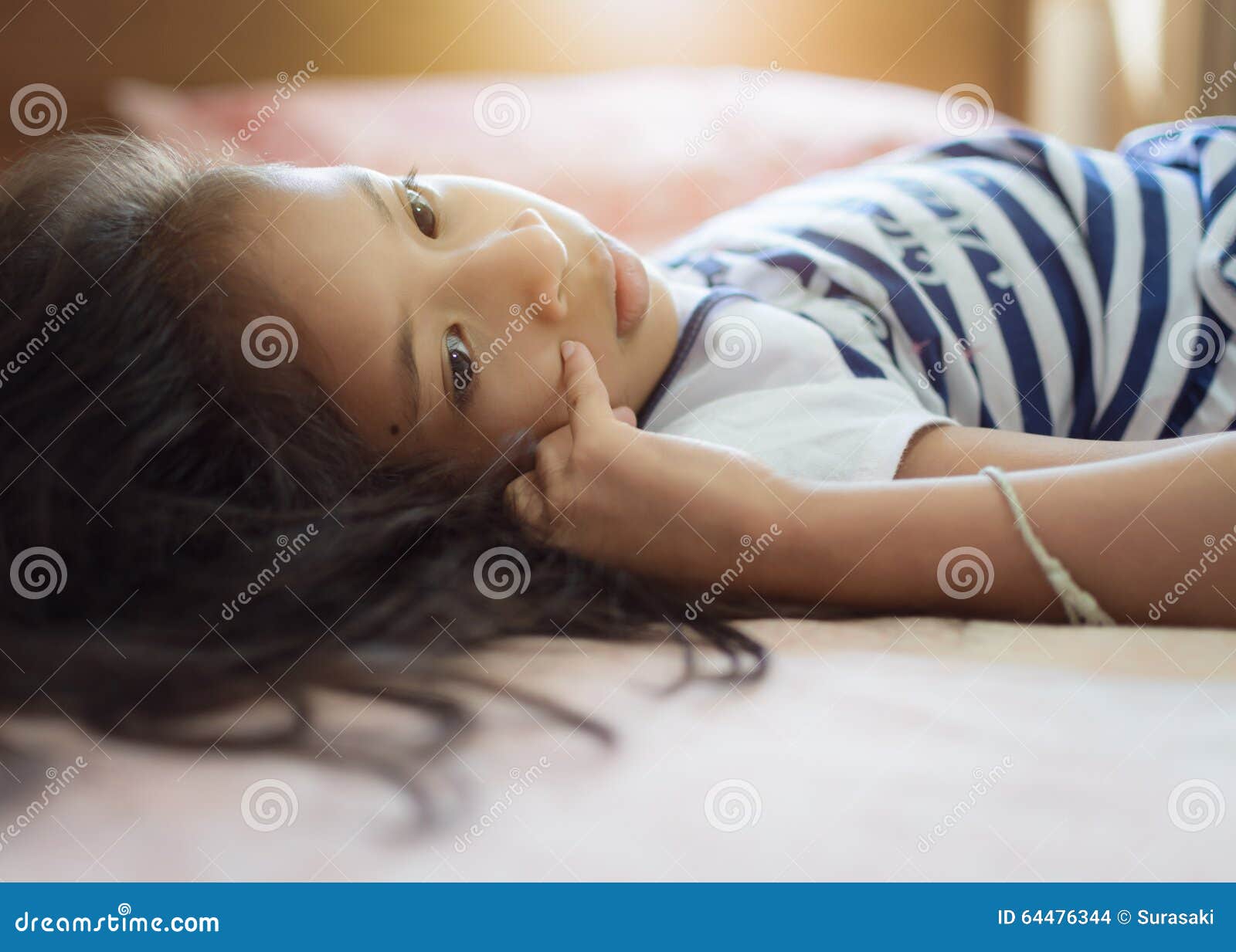 Cute Girl Lie Down on the Bed Stock Photo - Image of eyelash, love ...