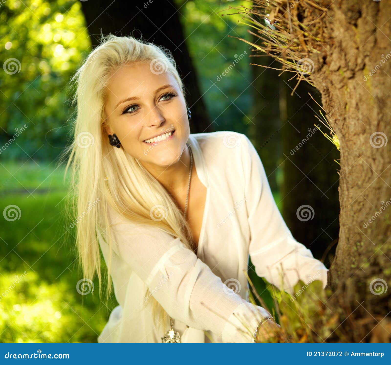 Cute Girl Looking Out from Behind a Tree Stock Photo - Image of ...