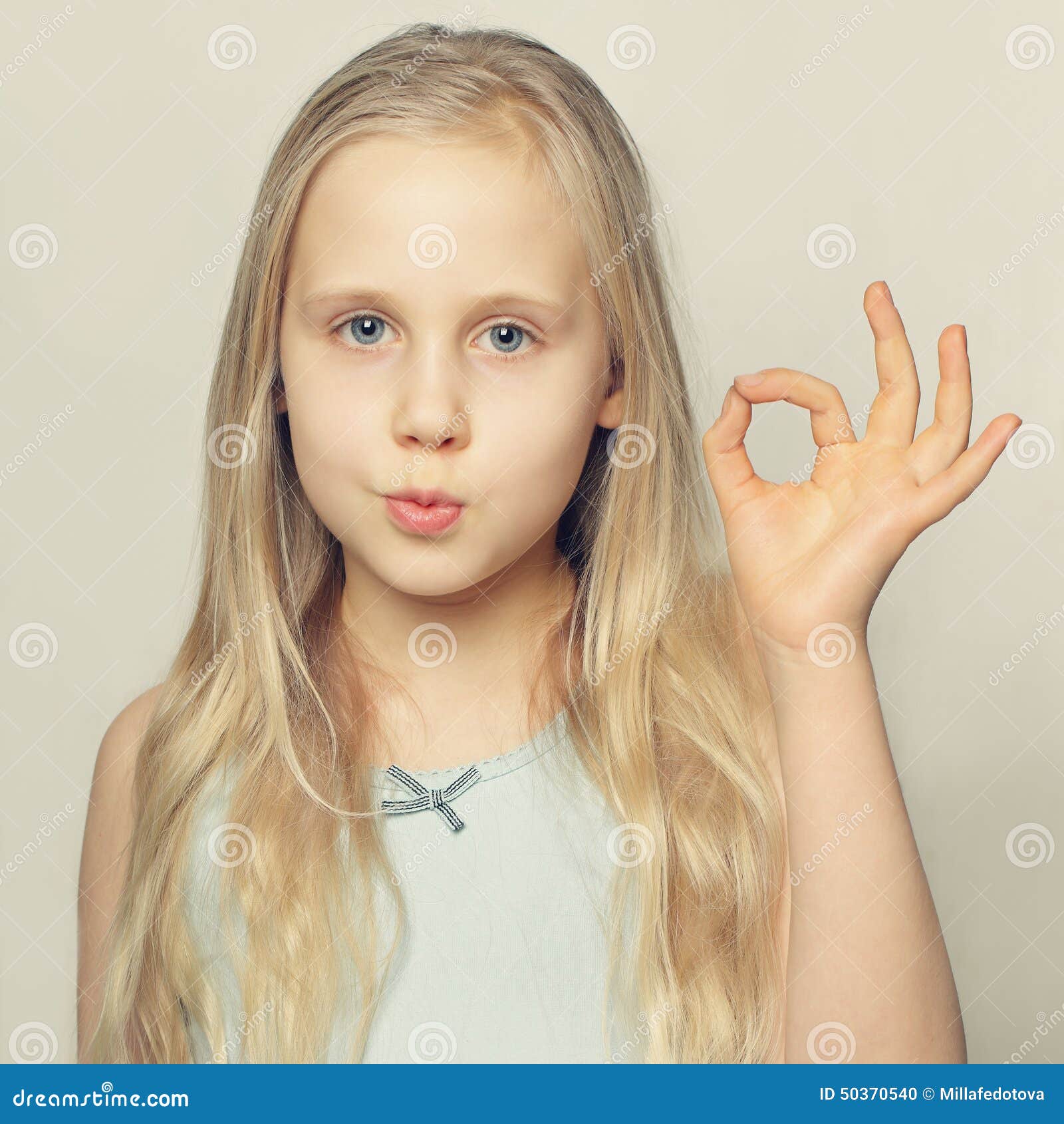 Cute girl showing OK stock photo. Image of child, playful - 50370540