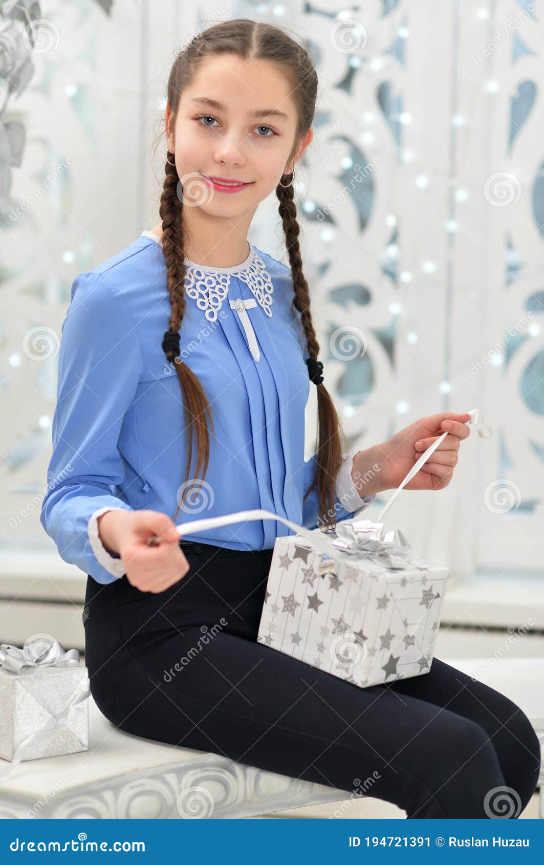 Cute Girl Sitting with Gift in Studio Stock Image - Image of casual ...