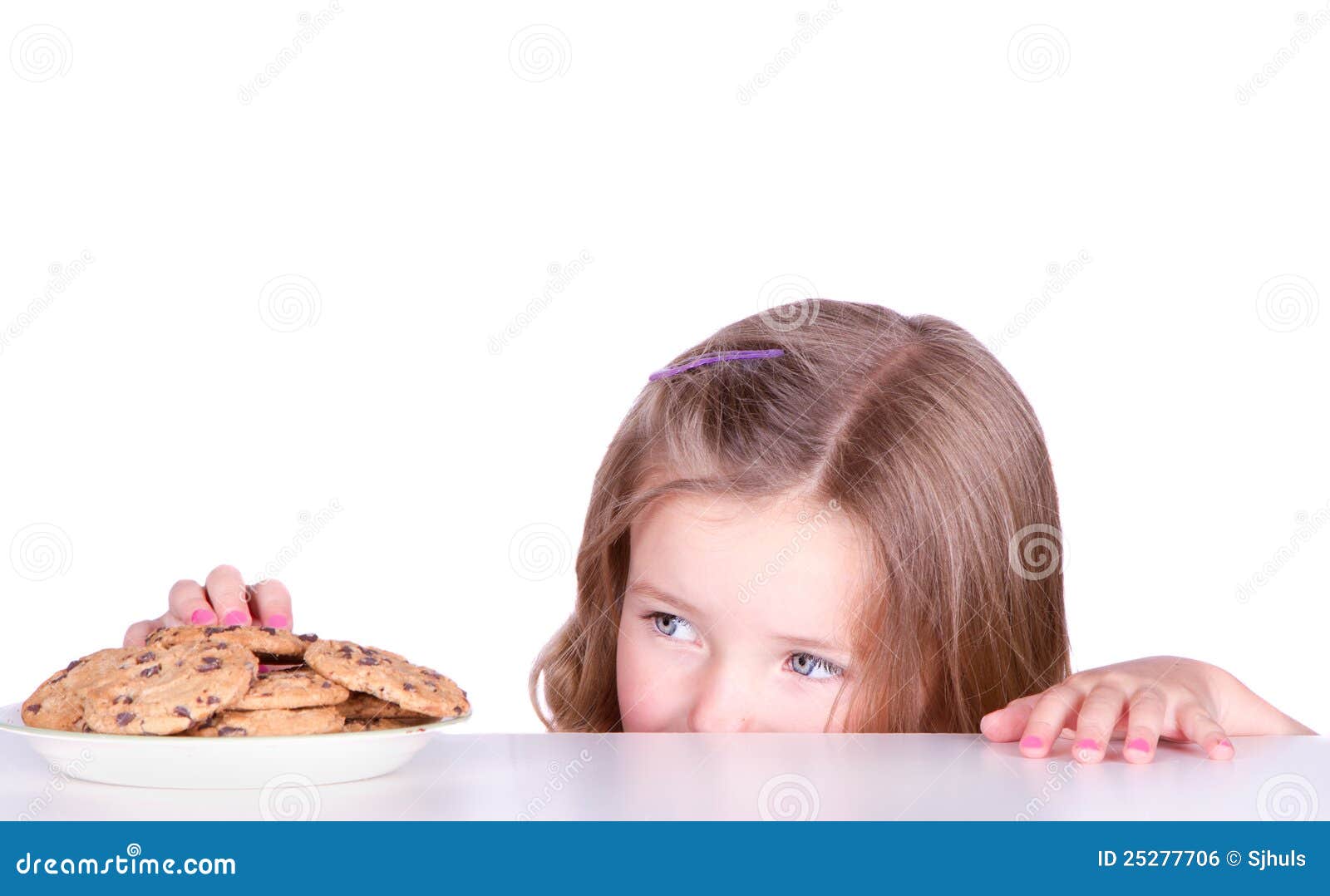 A cute girl steals cookies stock photo. Image of food - 25277706