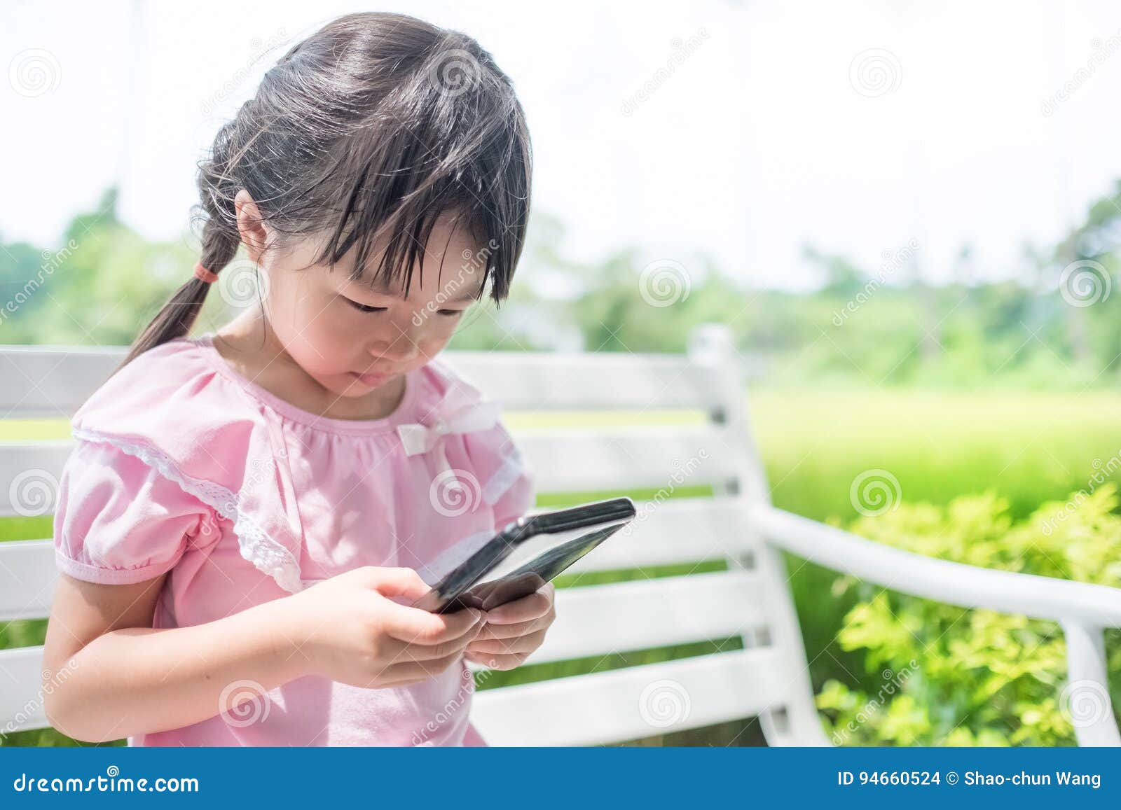 Cute girl use phone stock photo. Image of mobile, cellphone - 94660524