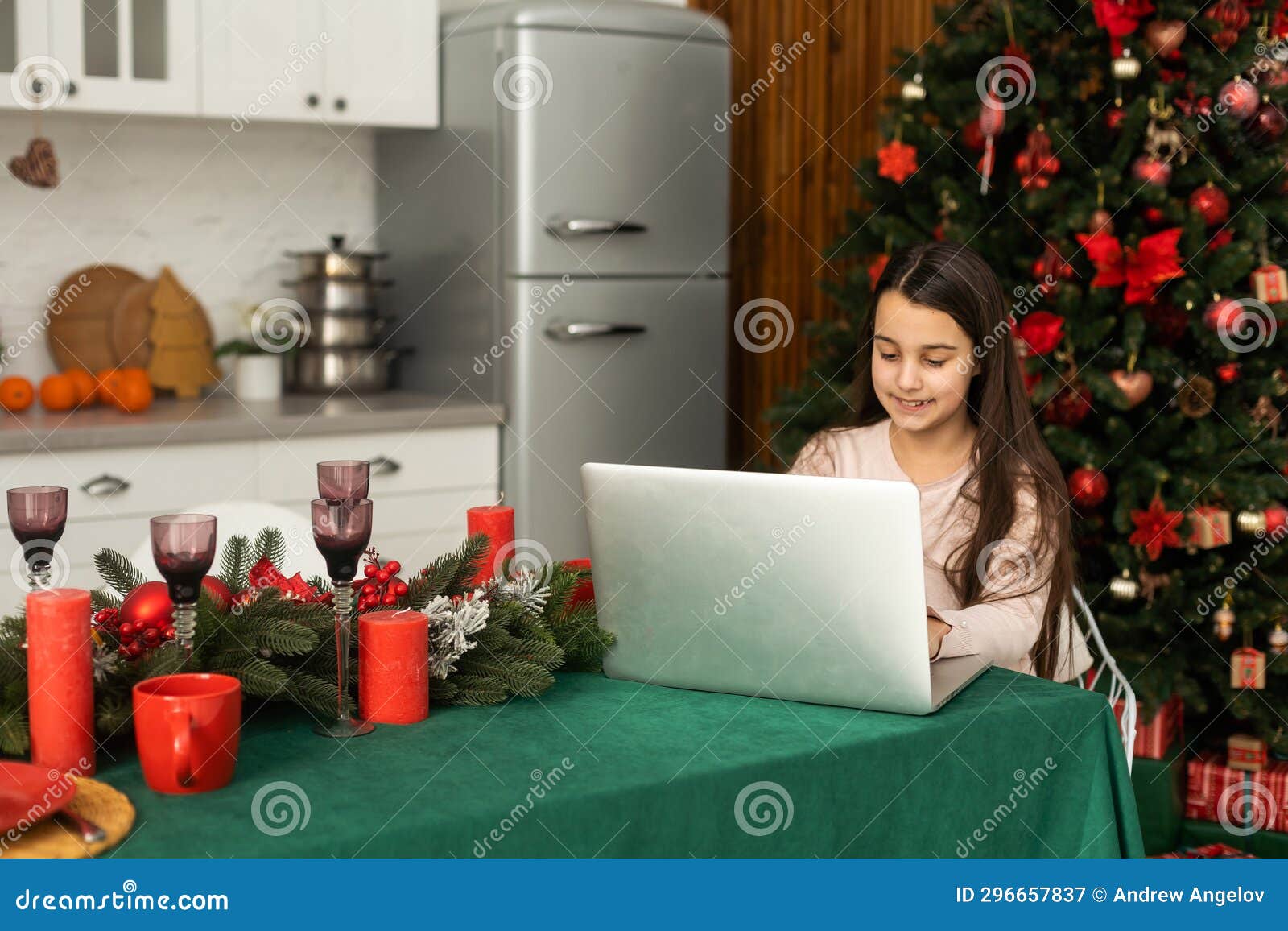 Cute Girl Using Computer by Christmas Tree Stock Image - Image of cozy ...