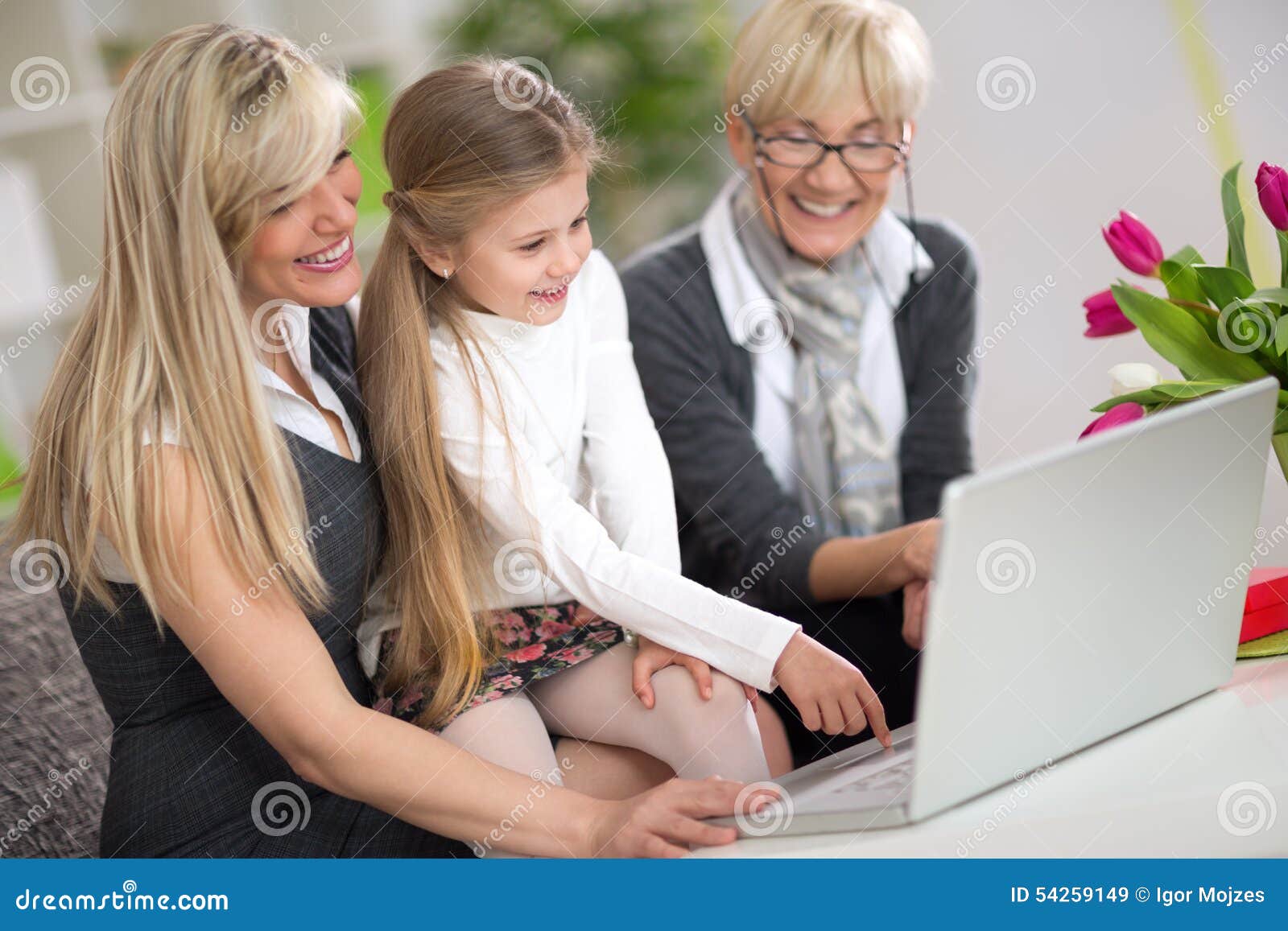 Cute Girl Using Laptop with Mom and Grandma Stock Image - Image of ...