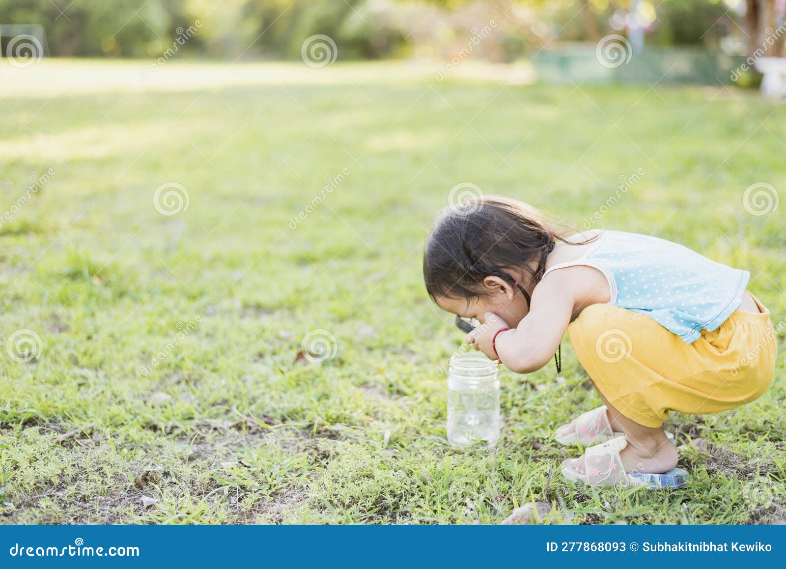 Cute Girl Using Magnifying Glass To Look at Bugs in Glass Jars Learn To ...