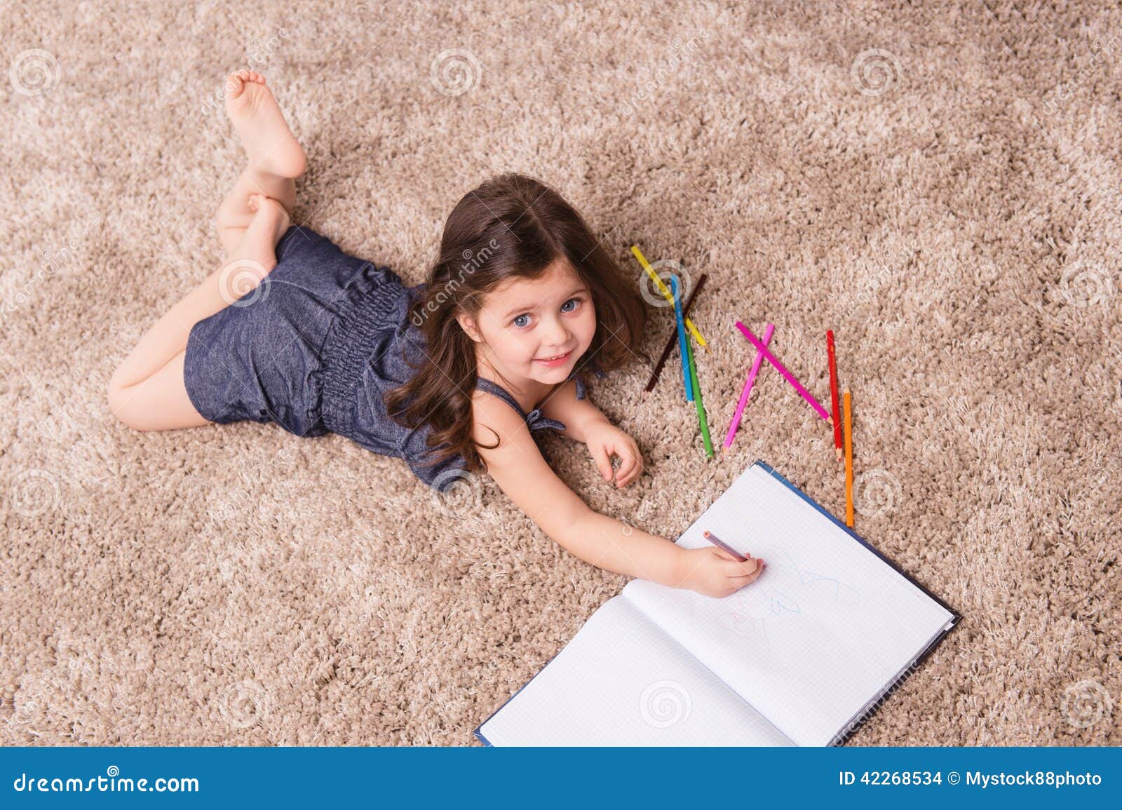 Cute Girl Writing Letter on Floor. Stock Photo - Image of expression ...